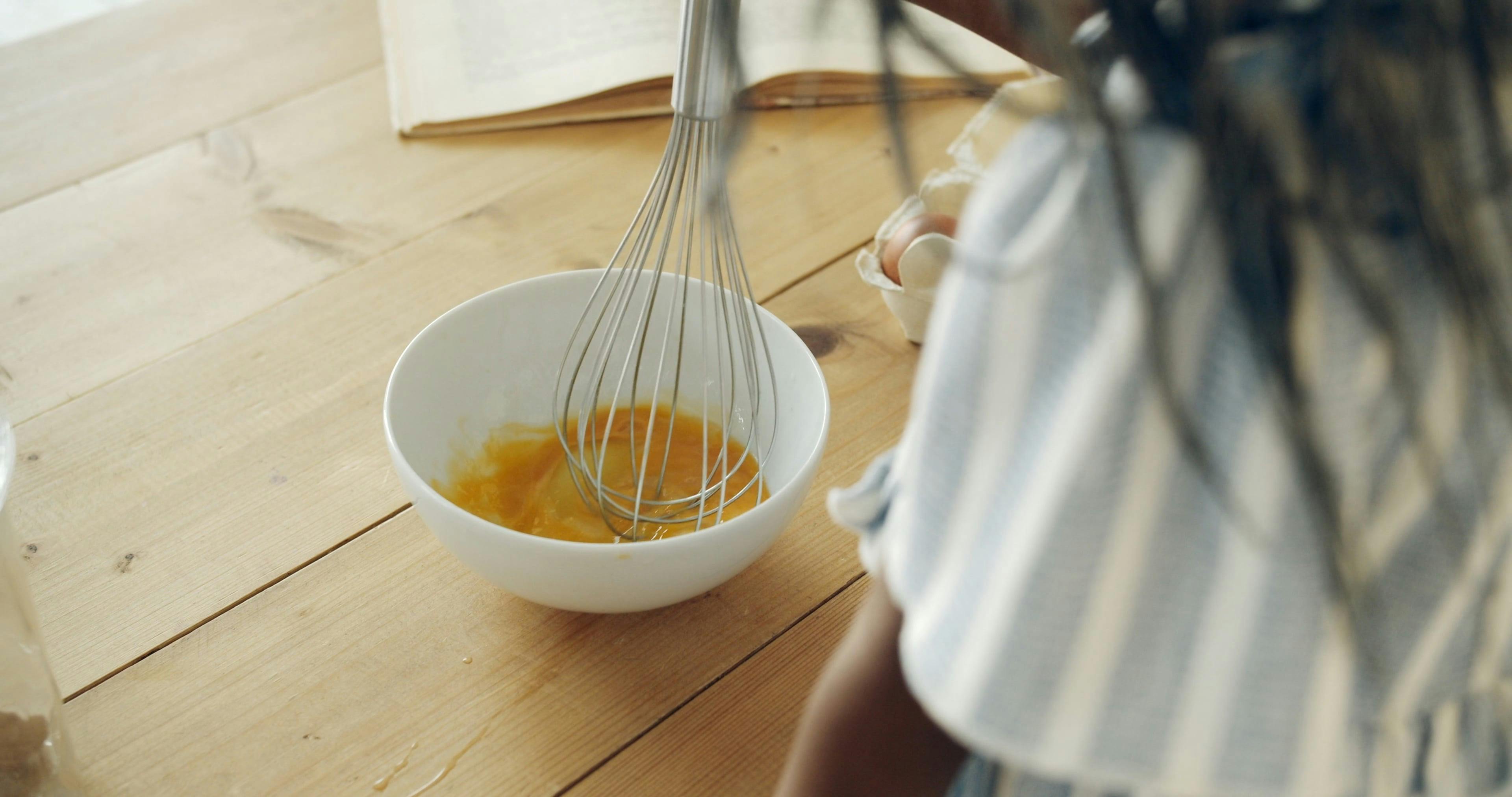 Person Using a Whisker for Stirring · Free Stock Video