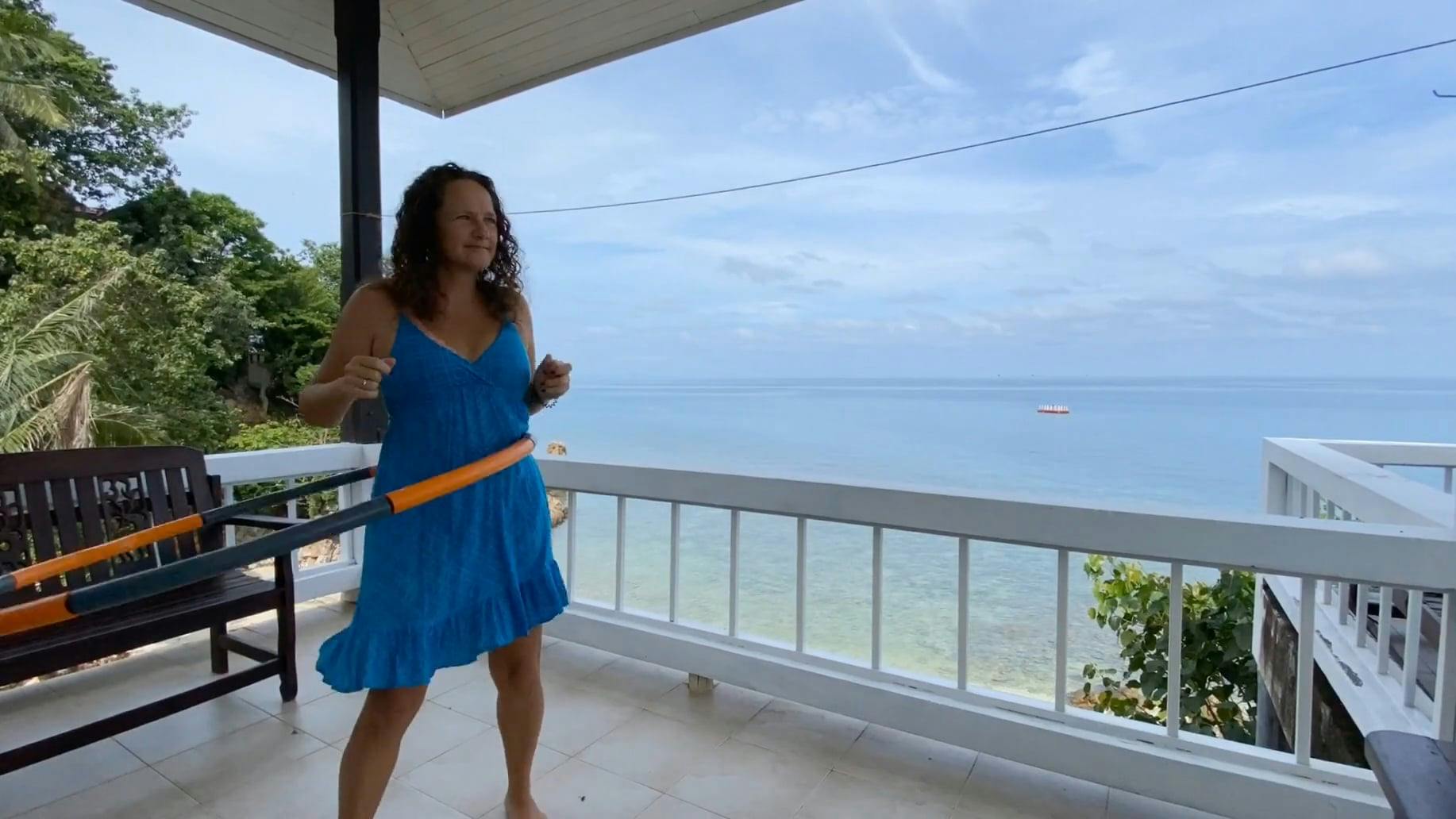 A Woman Holding a Hula Hoop While Looking at Camera Free Stock Video ...