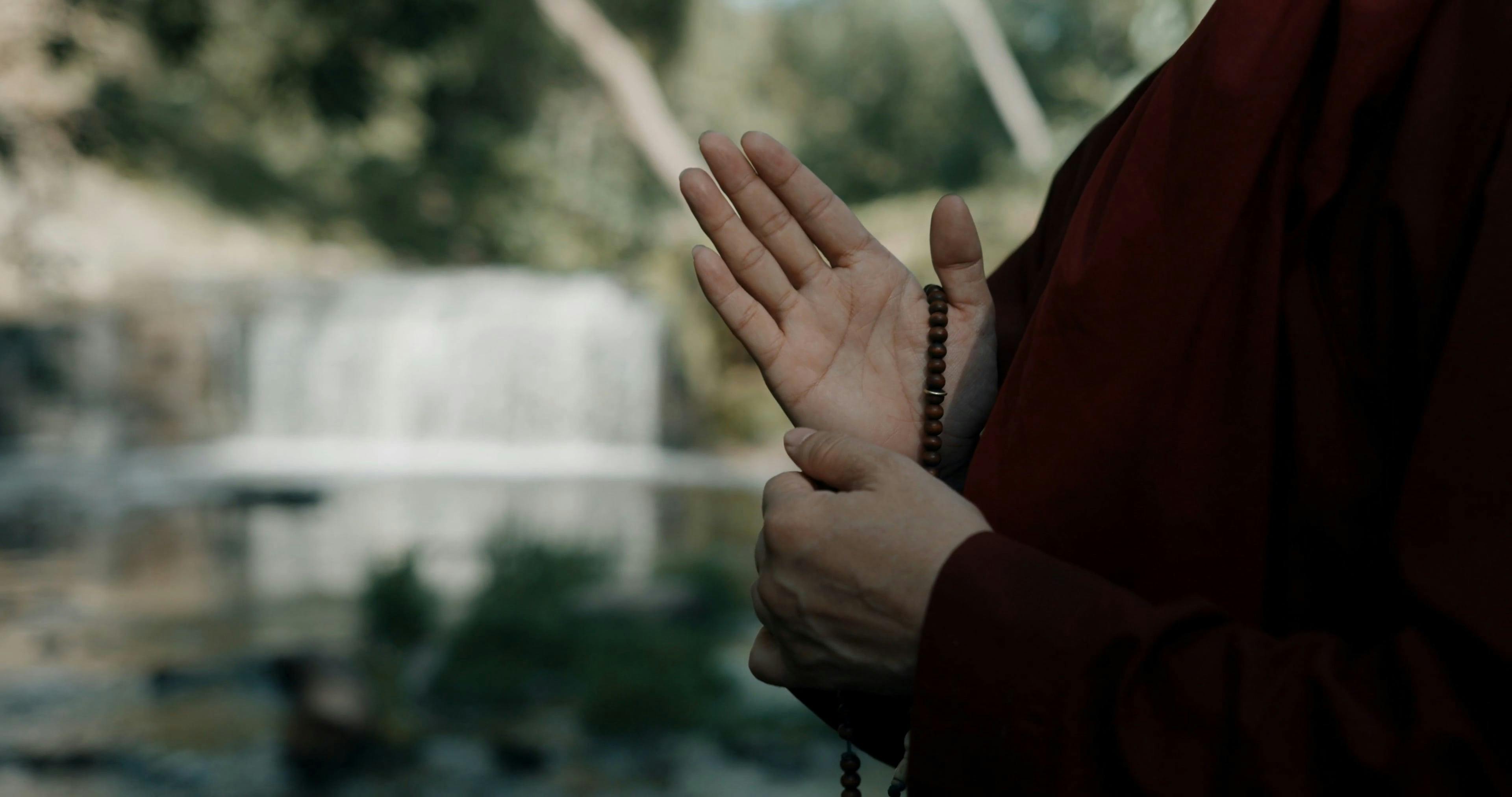 A Monk Praying Outdoors · Free Stock Video