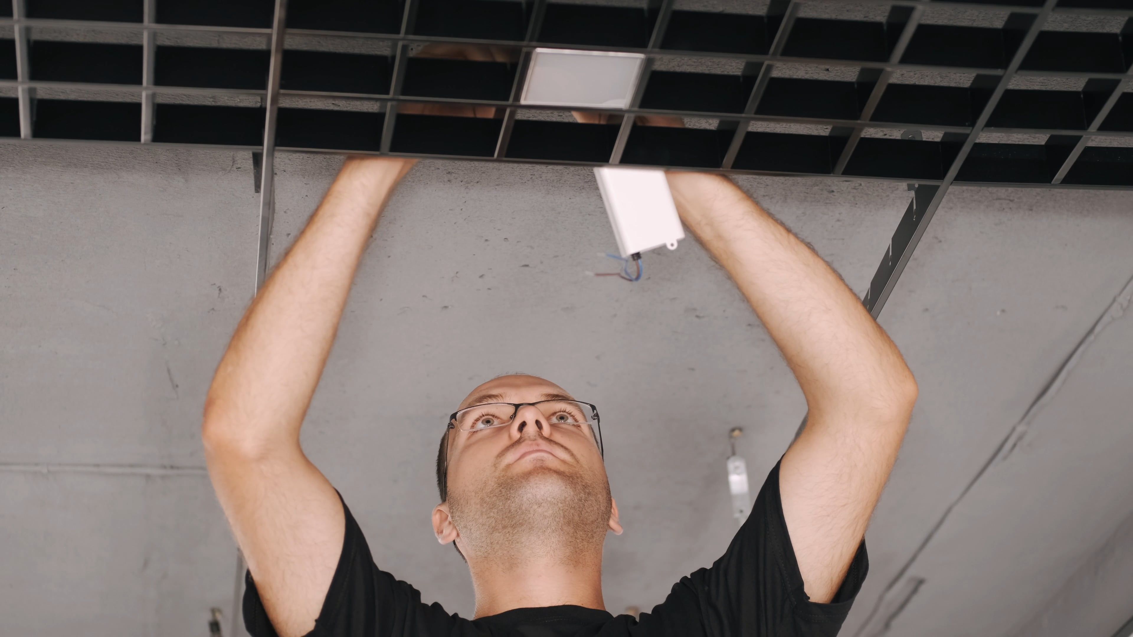 Young Man Fixing Light · Free Stock Video