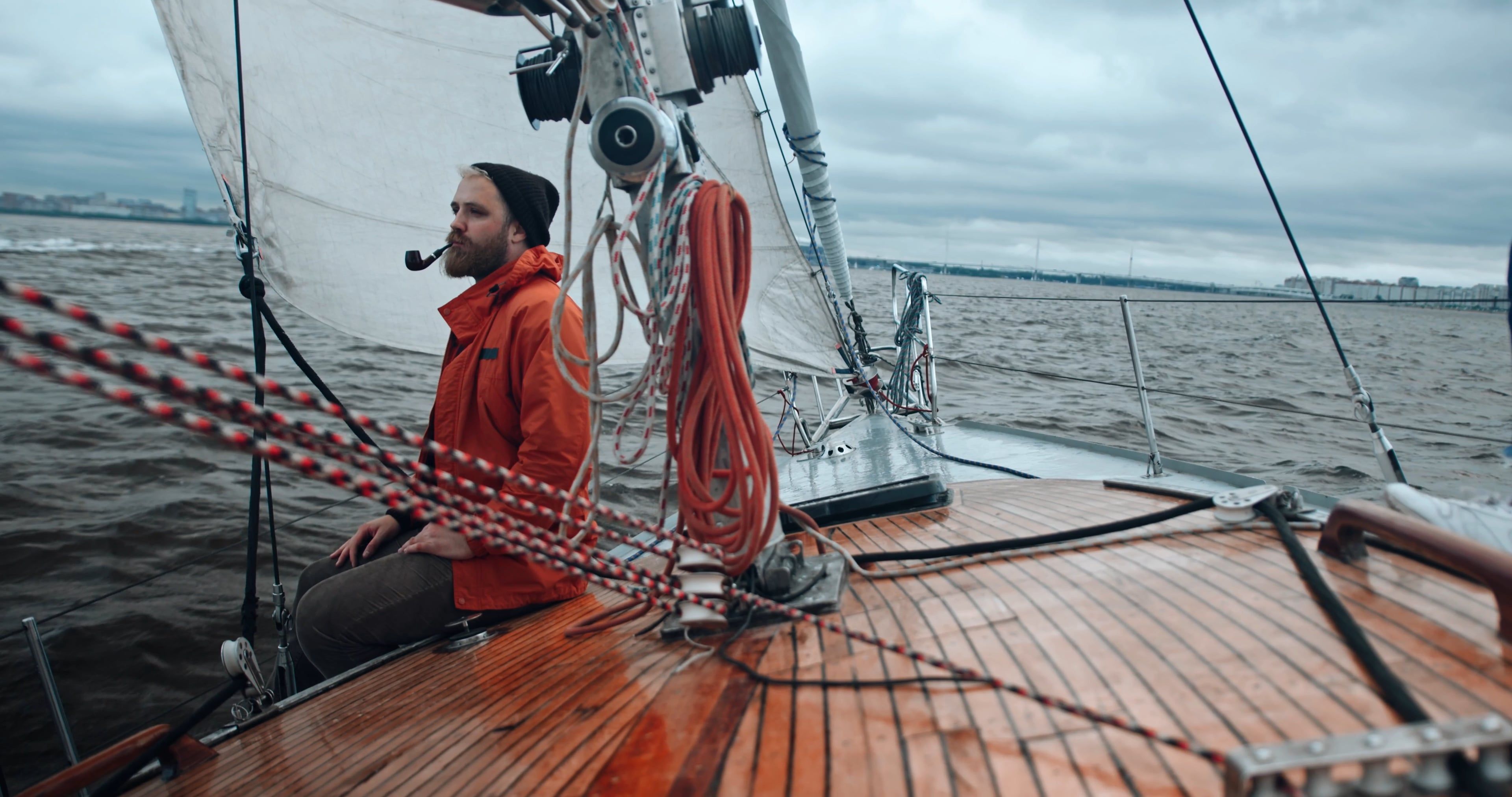 A Man Smoking Tobacco Pipe on a Moving Boat · Free Stock Video