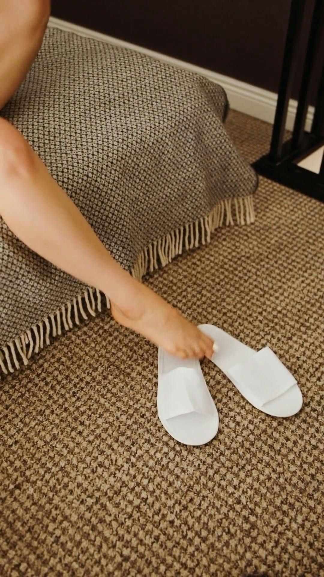 A Person Putting On Slippers · Free Stock Video