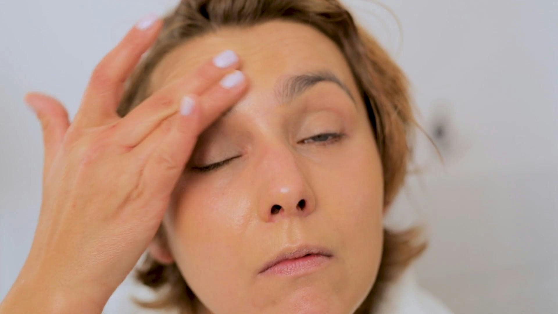 A Young Woman Arranging Her Eyebrow With Using A Brow Brush Free Stock ...