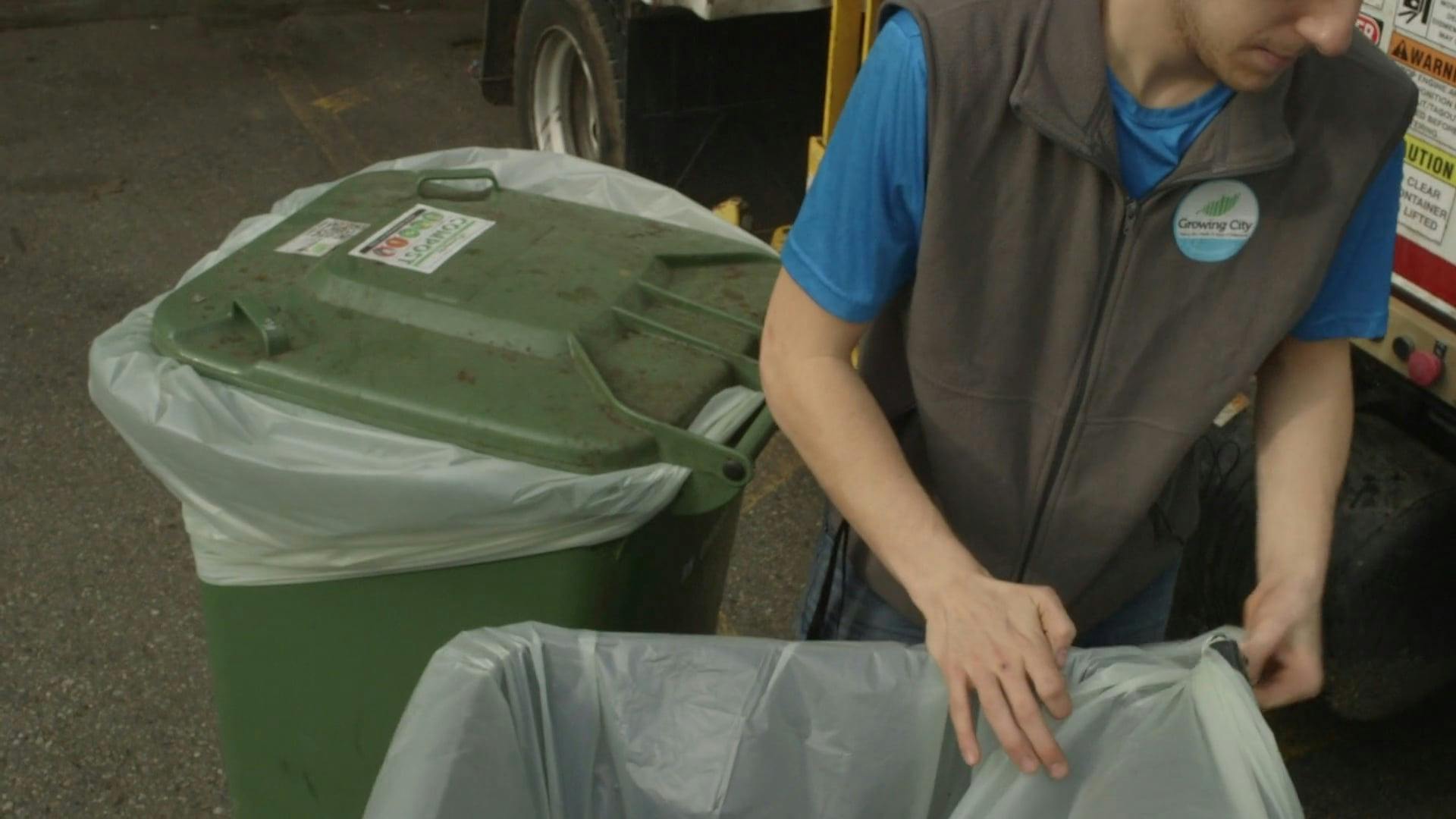 Man Putting a Plastic Bags on the Bins · Free Stock Video