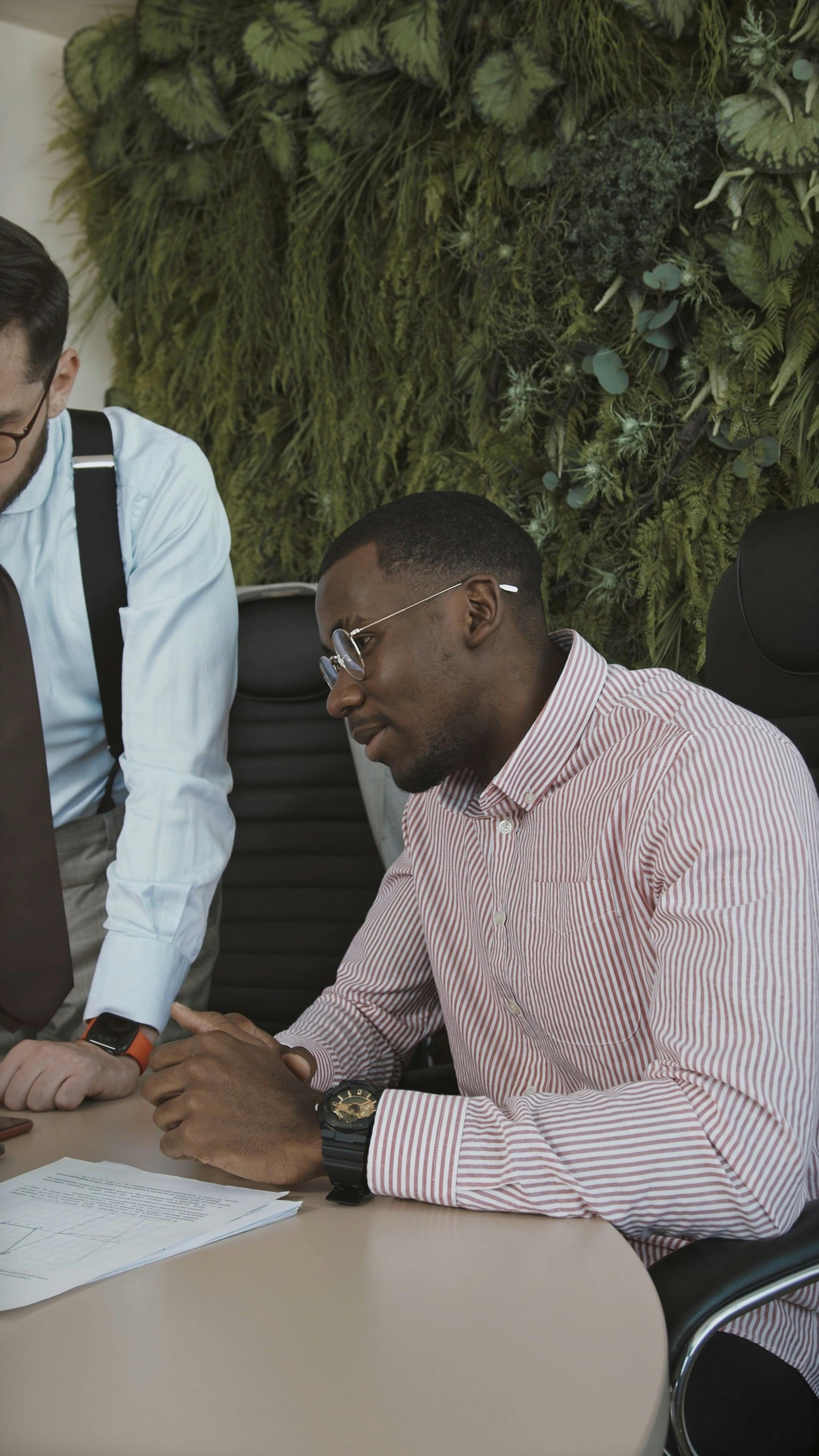 Boss Showing Business Strategies on Laptop to his Employees Free Stock ...