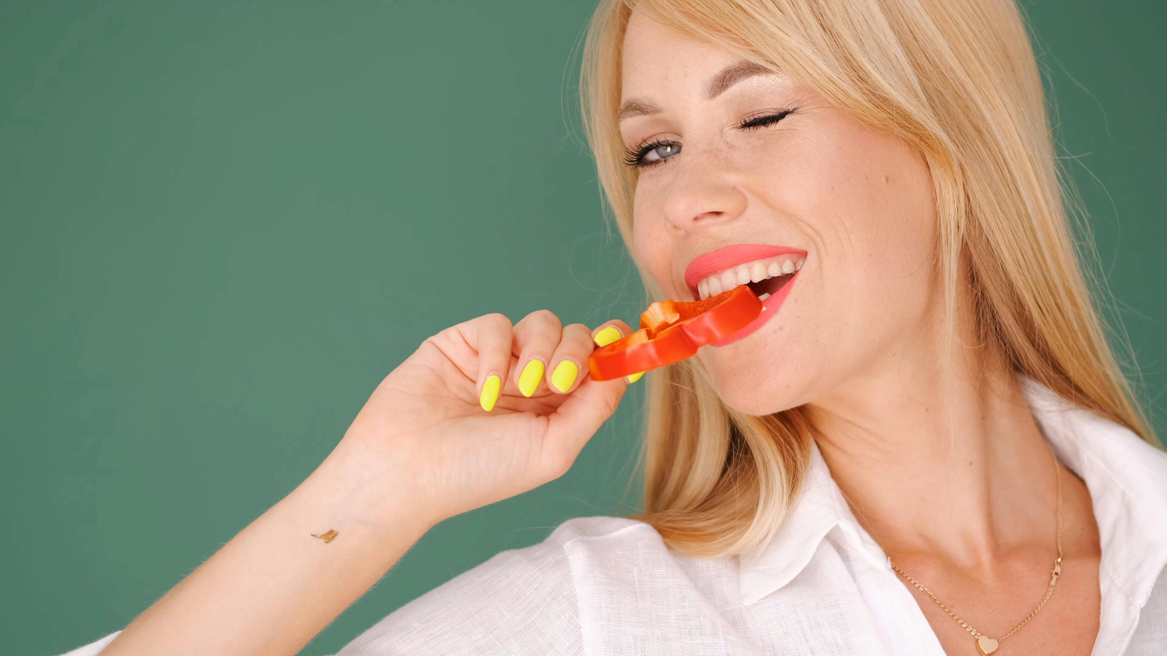 Woman Biting a Sliced Red Bell Pepper Free Stock Video Footage, Royalty ...
