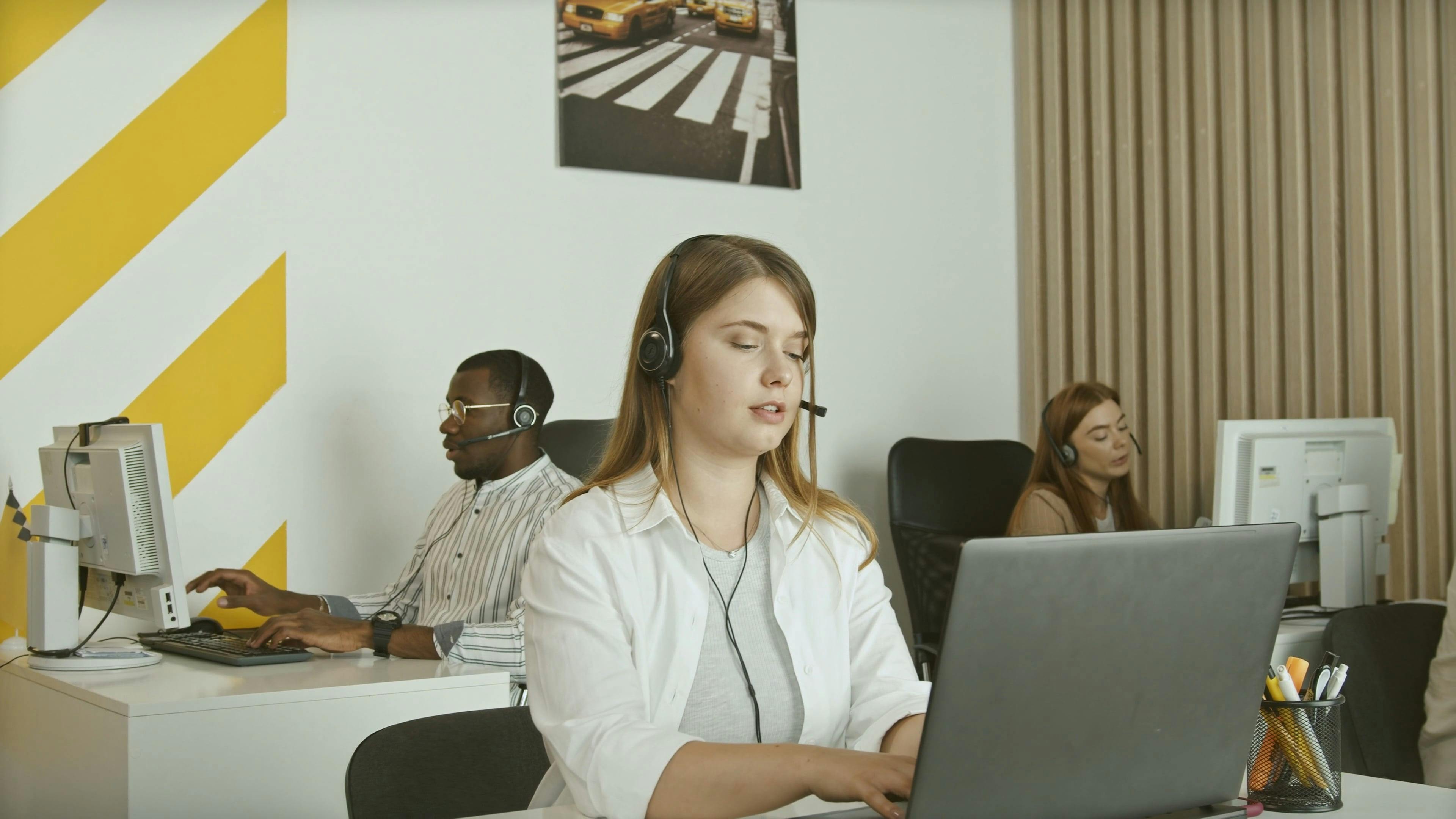 Female Customer Service Staff Working on Laptop and Talking Customer ...