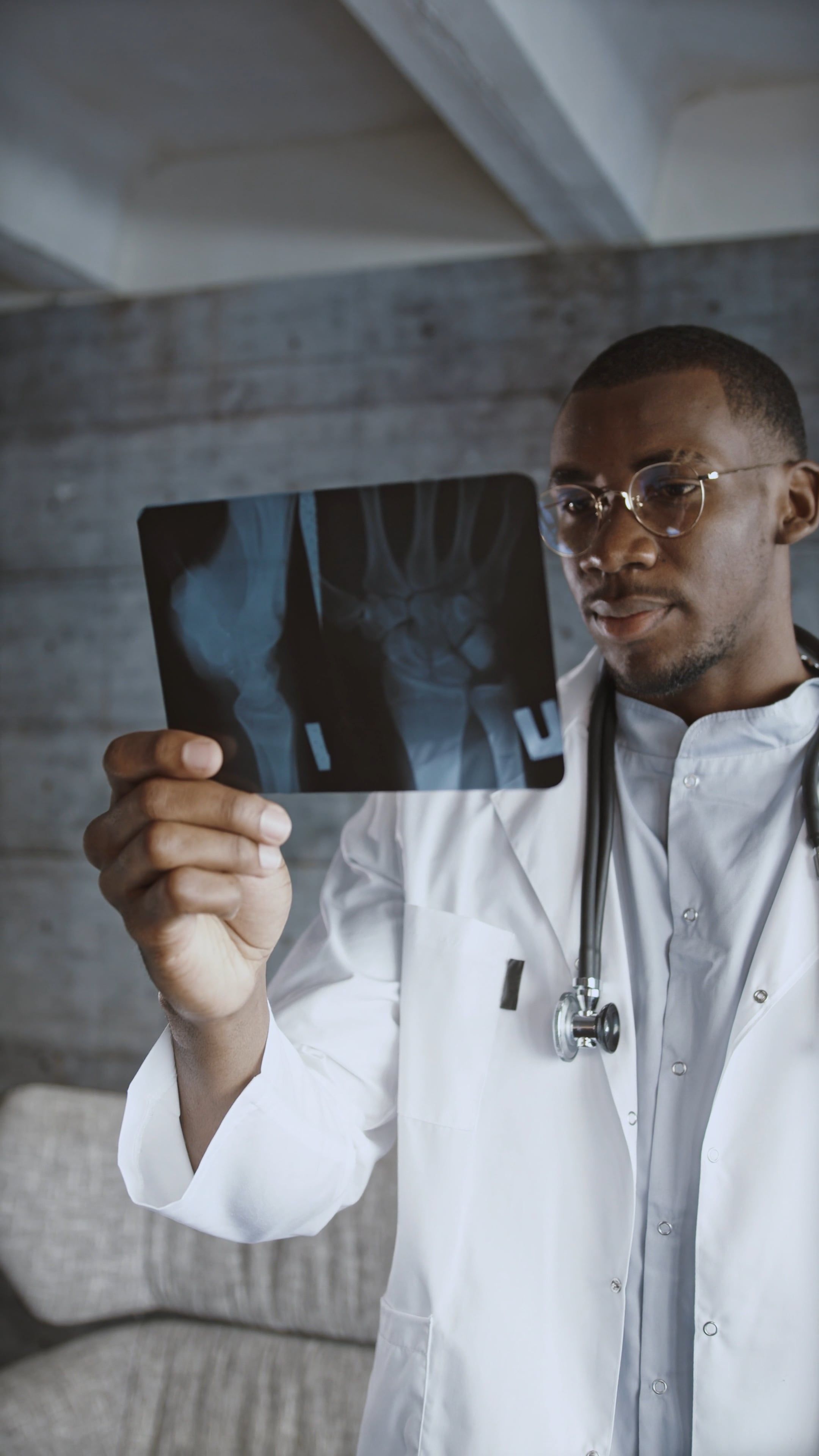 Young Doctor Looking at X Ray · Free Stock Video
