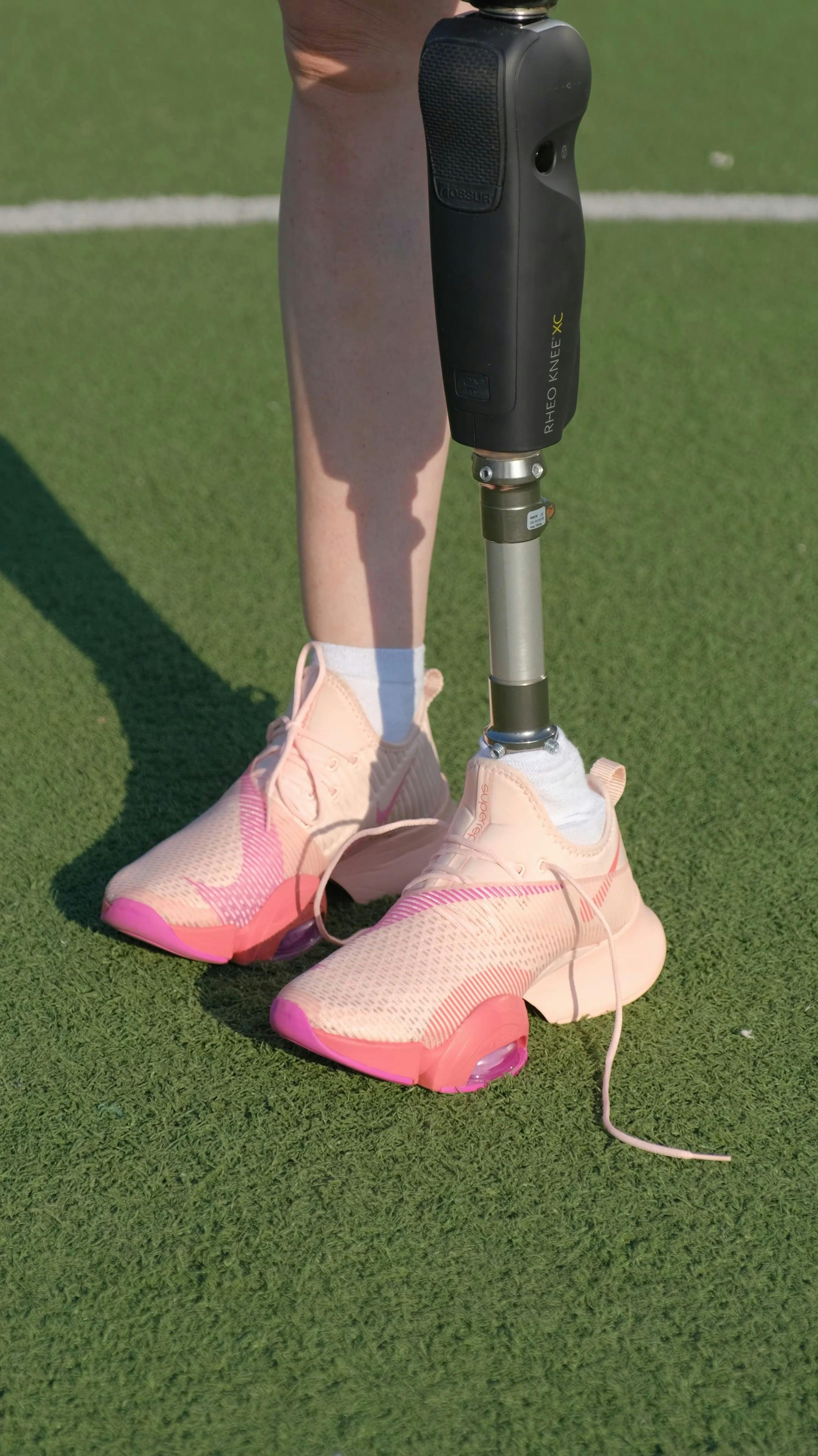 Person with a Prosthetic Leg Tying Her Shoe · Free Stock Video