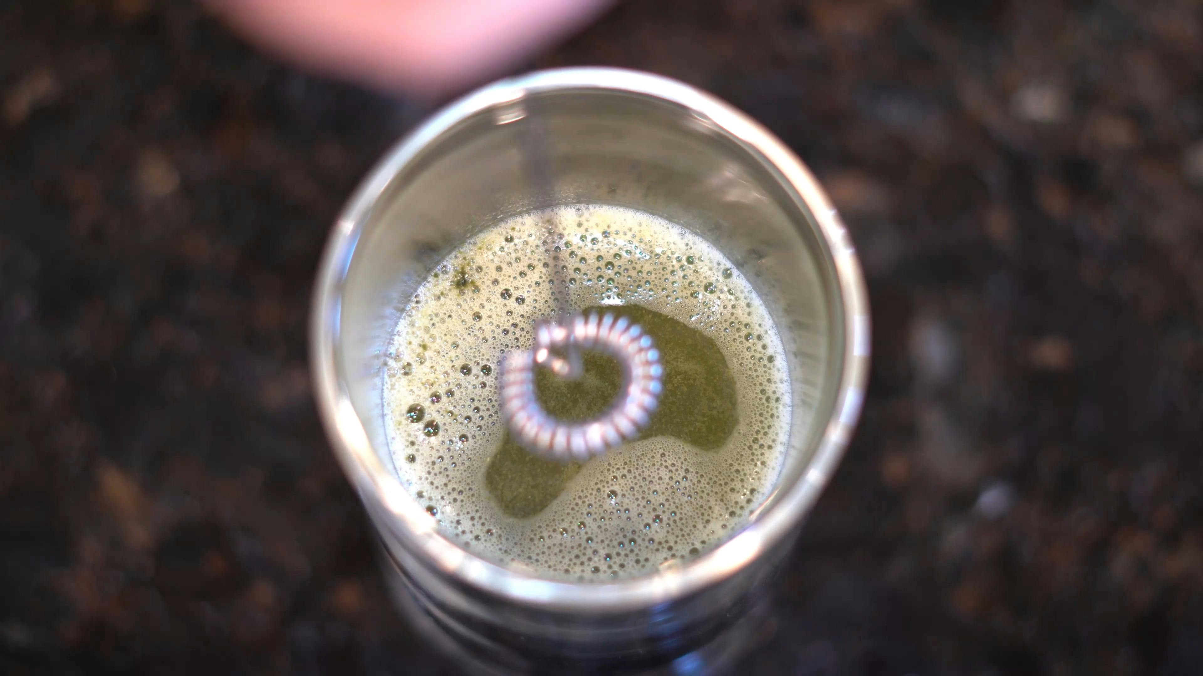 Person Mixing the Green Tea · Free Stock Video