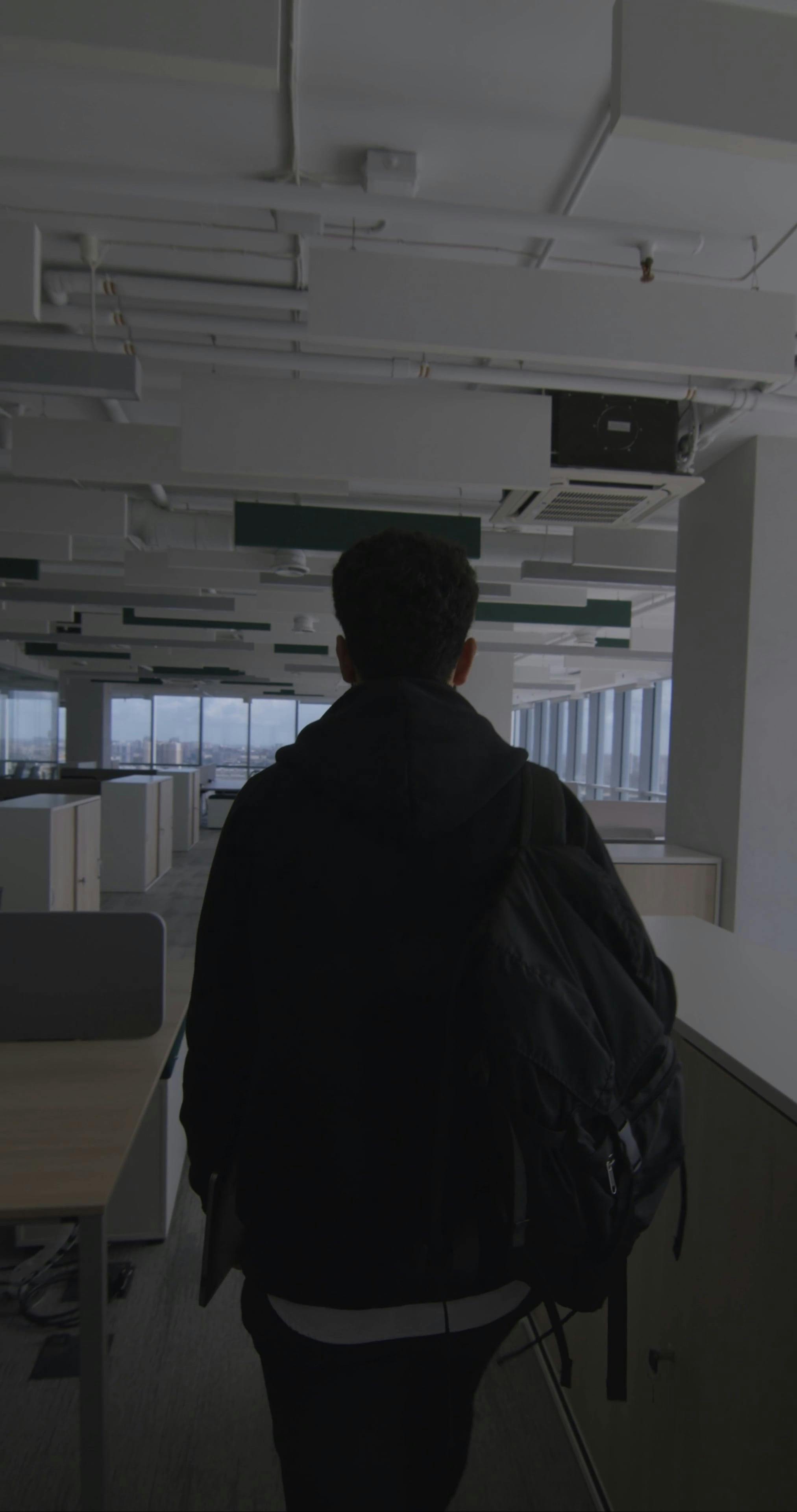 An Employee Coming to Office and Sitting at his Workdesk · Free Stock Video