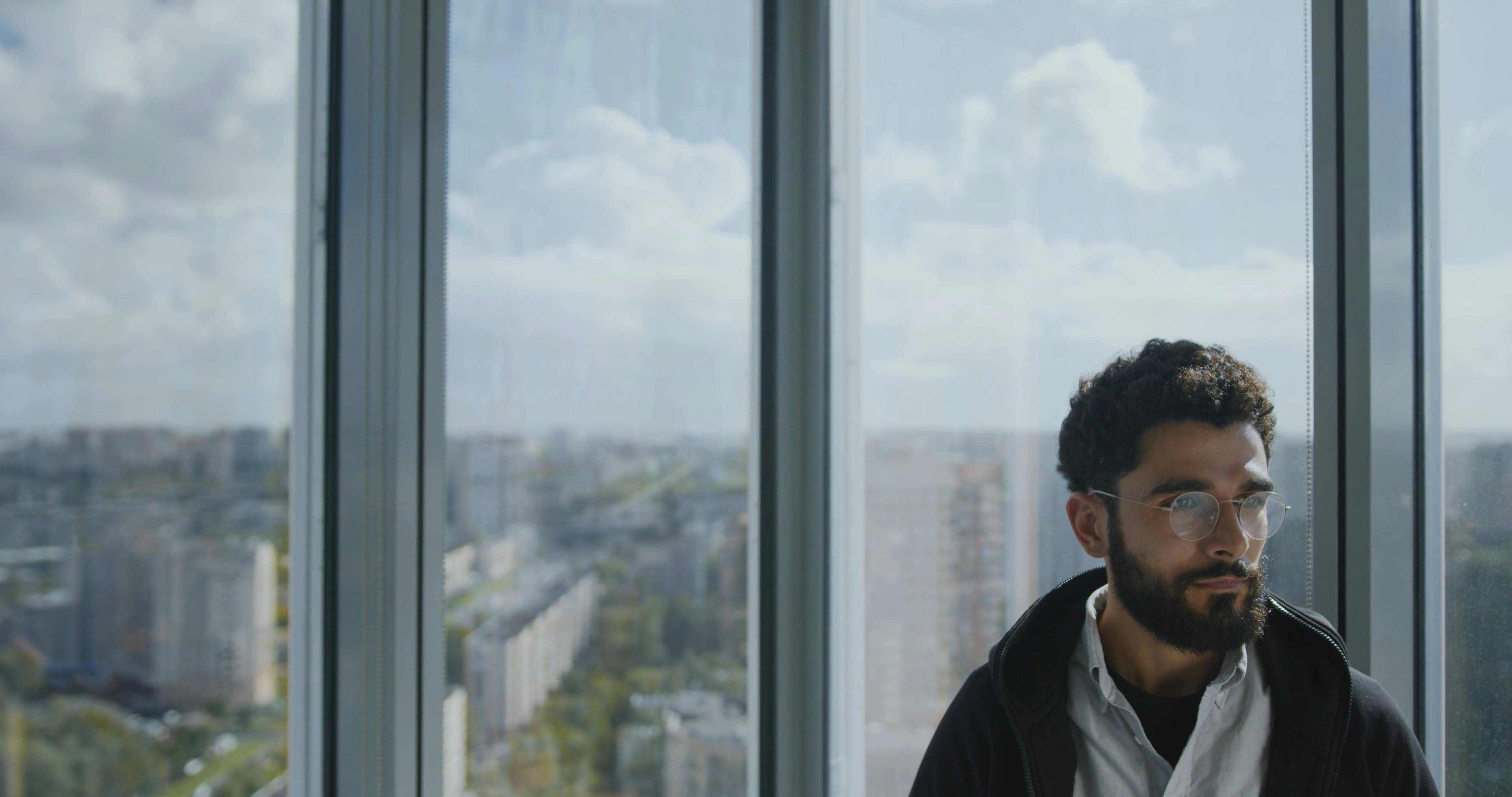 A Man Talking Beside the Window · Free Stock Video