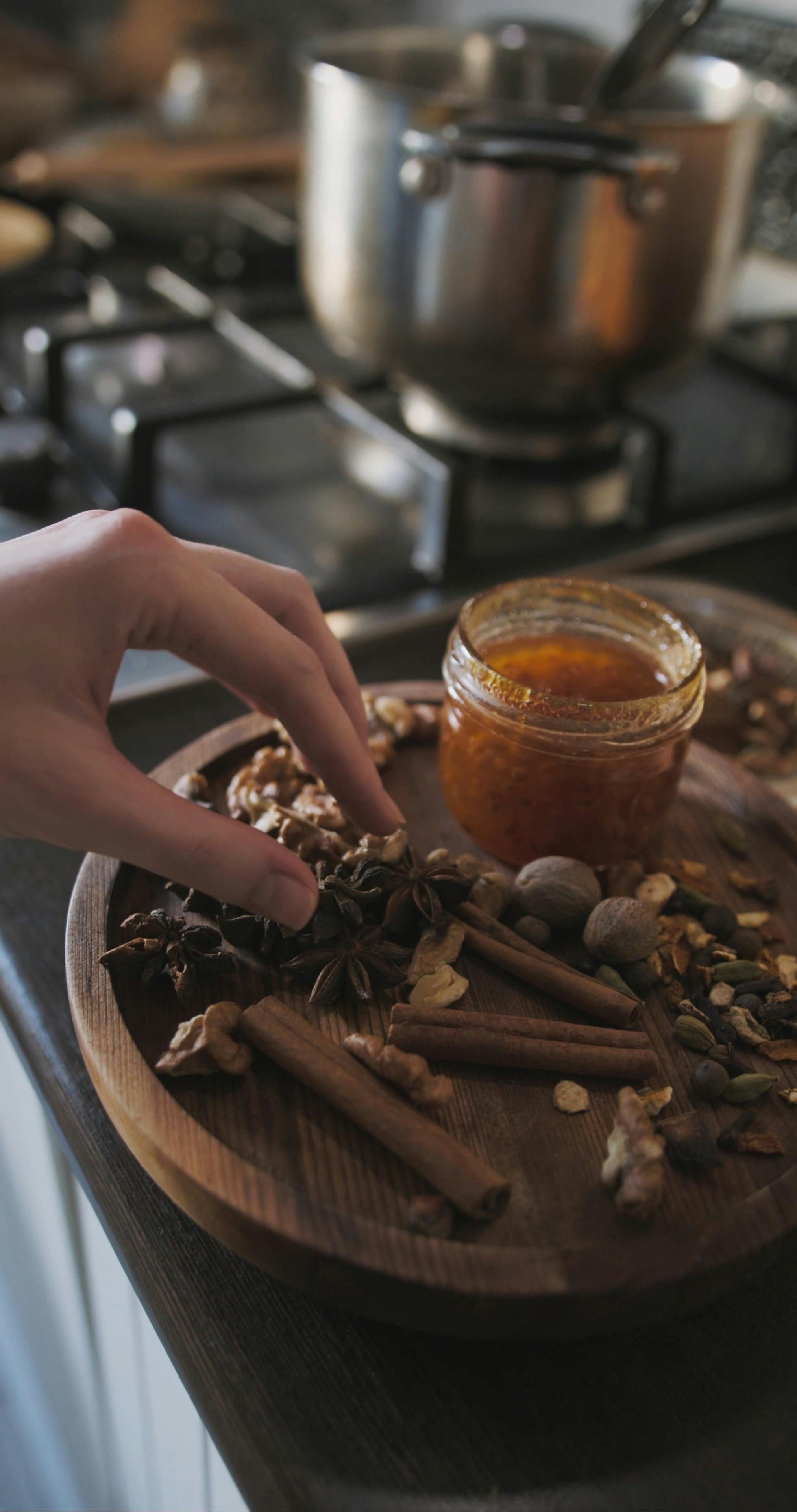 A Person Putting Spices in a Cooking Pot · Free Stock Video