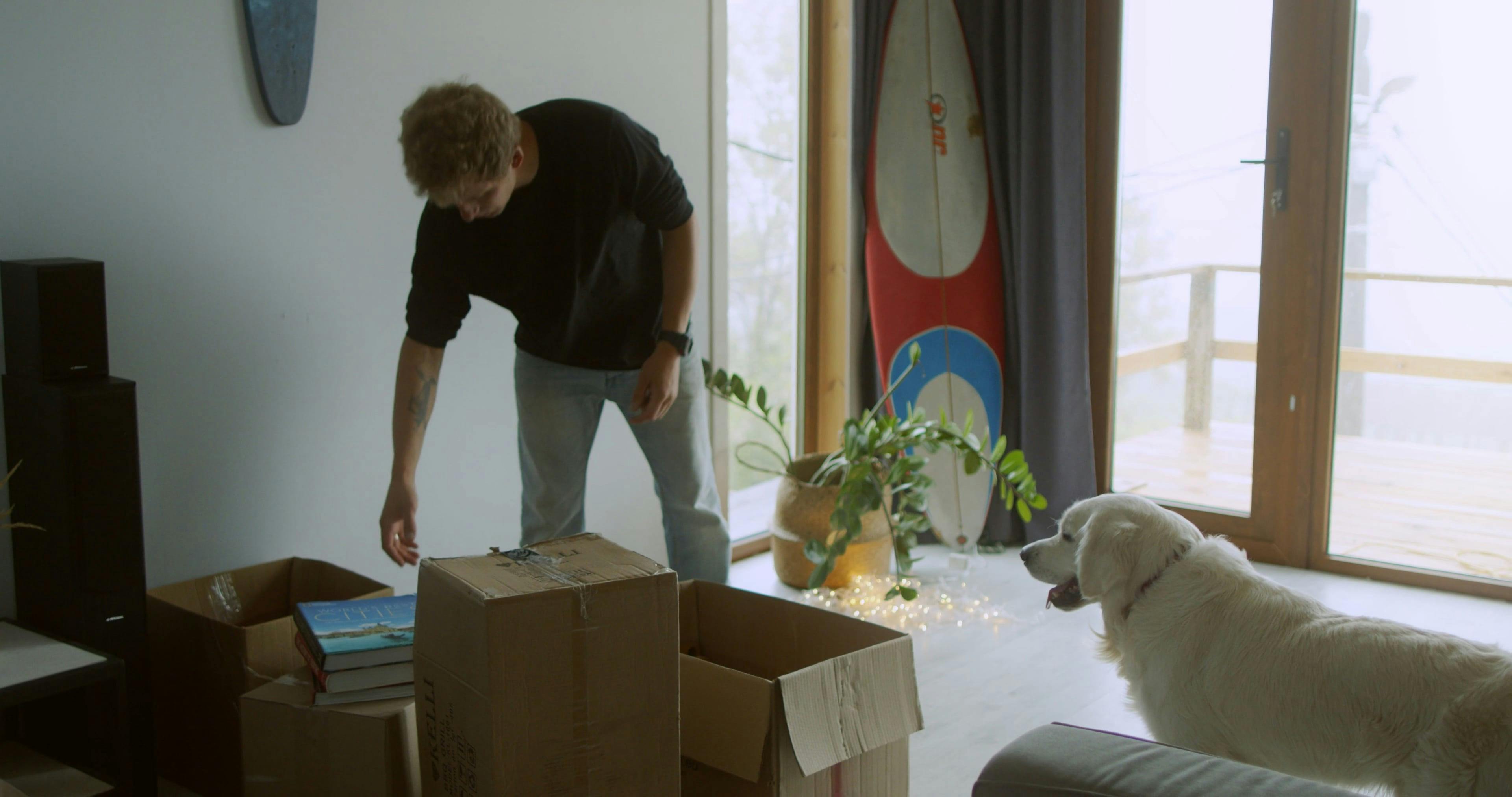 A Man Picking Up a Box the Giving it to the Woman · Free Stock Video