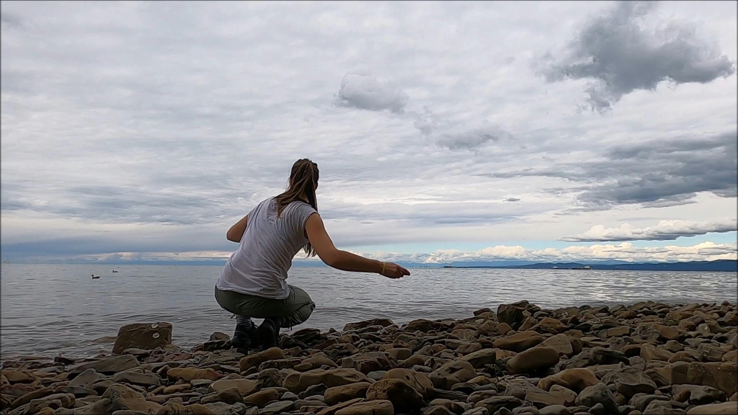 Woman Throwing Rocks into the Sea Free Stock Video Footage, Royalty ...