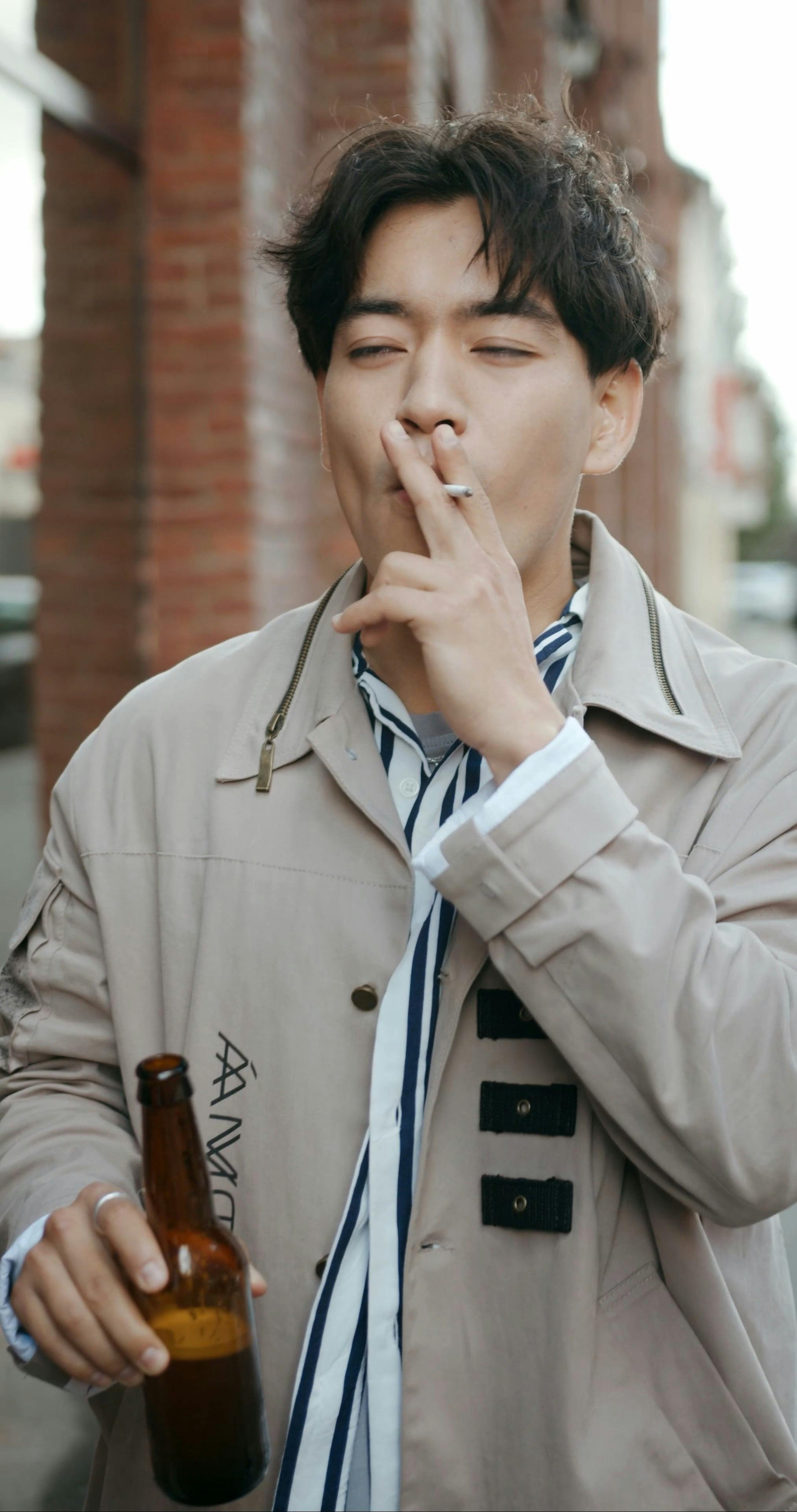 A Man Smoking His Cigarette While Drinking His Beer Free Stock Video ...