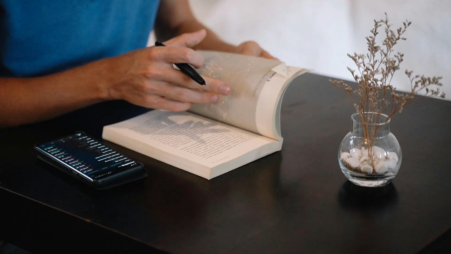 A Person Doing Research With Books And Electronic Datas Free Stock ...