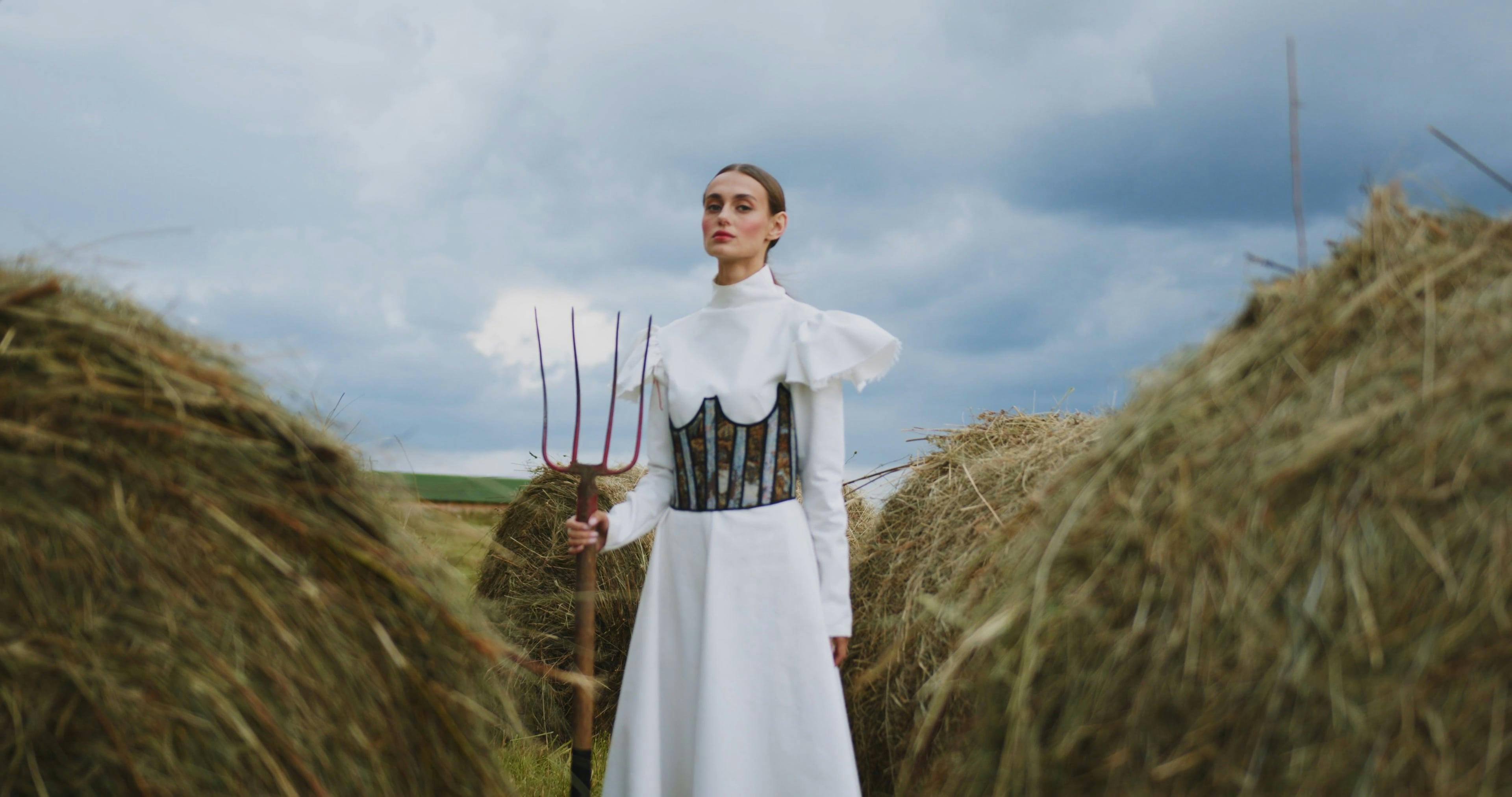 Woman Walking with a Pitchfork · Free Stock Video