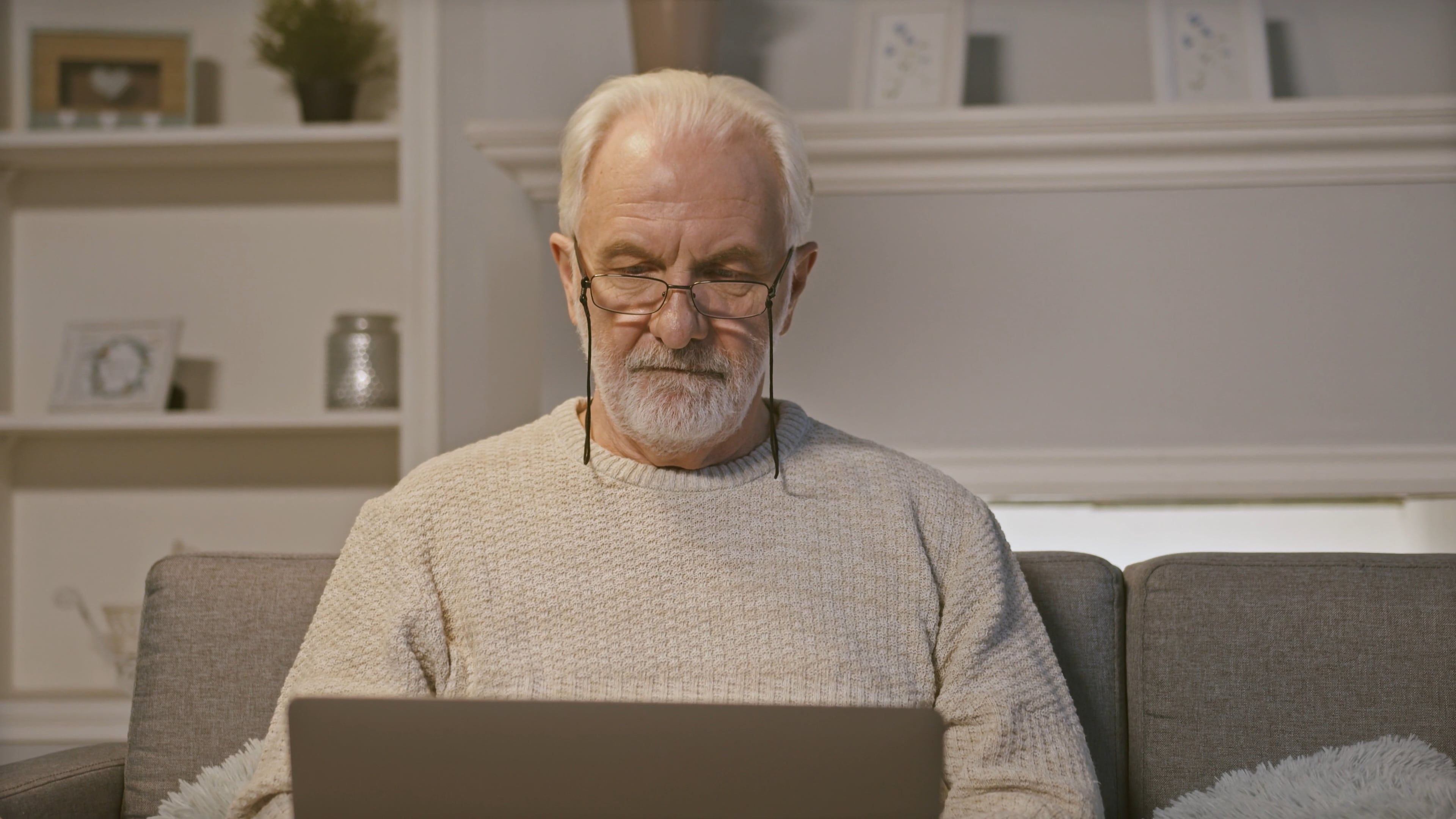 Elderly Man Using a Laptop · Free Stock Video
