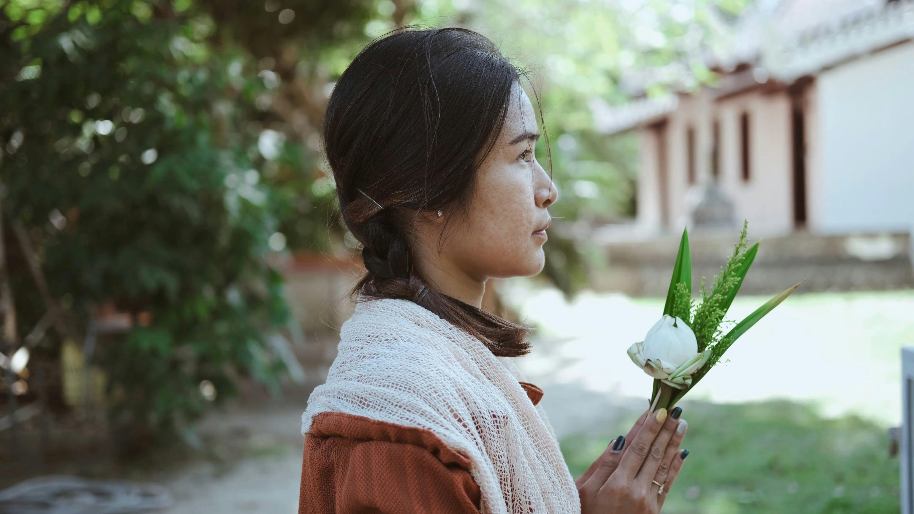 Buddhist Woman Praying Outdoors · Free Stock Video