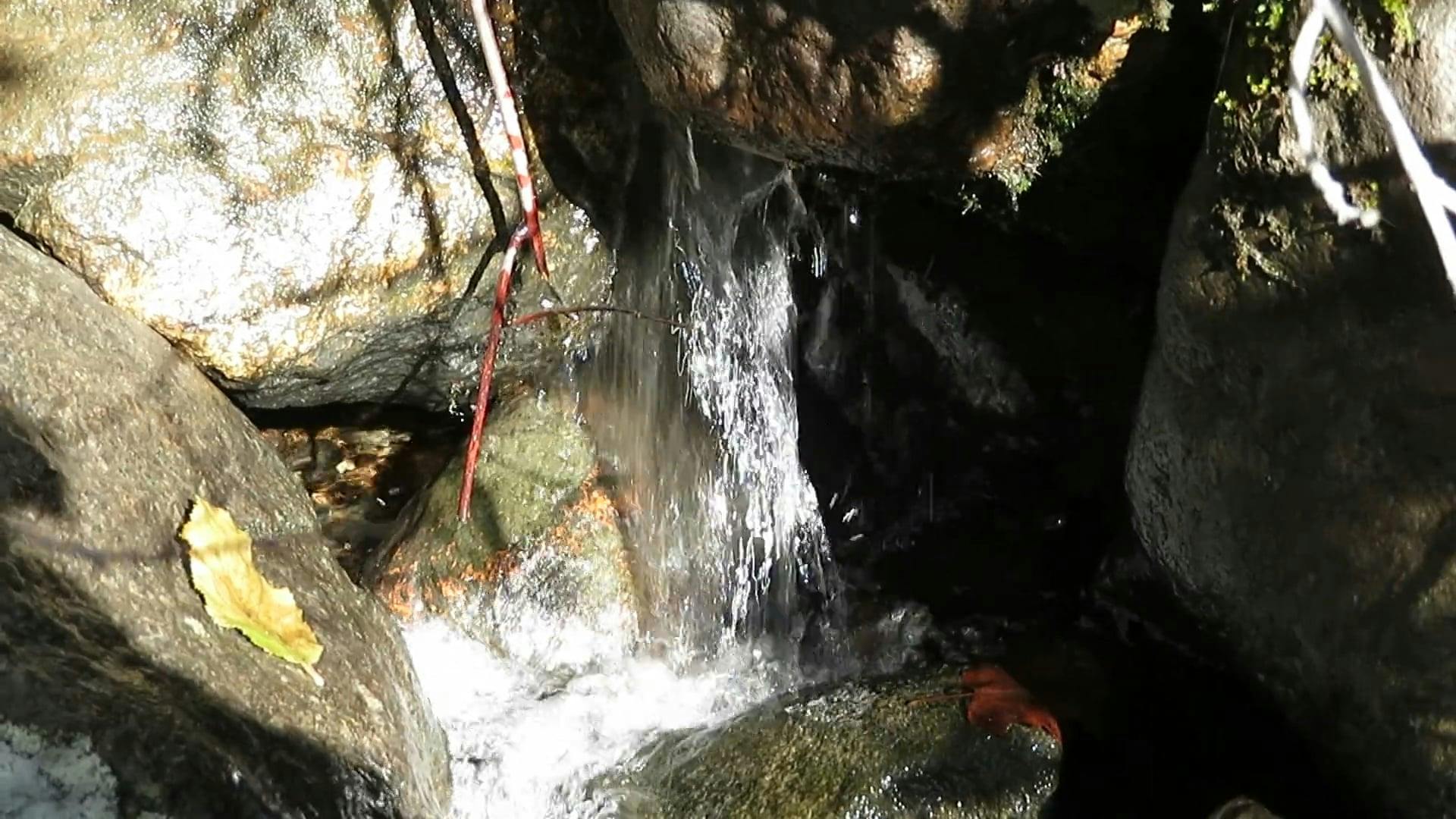 A Natural Spring Water Cascading In Rocks Free Stock Video Footage ...