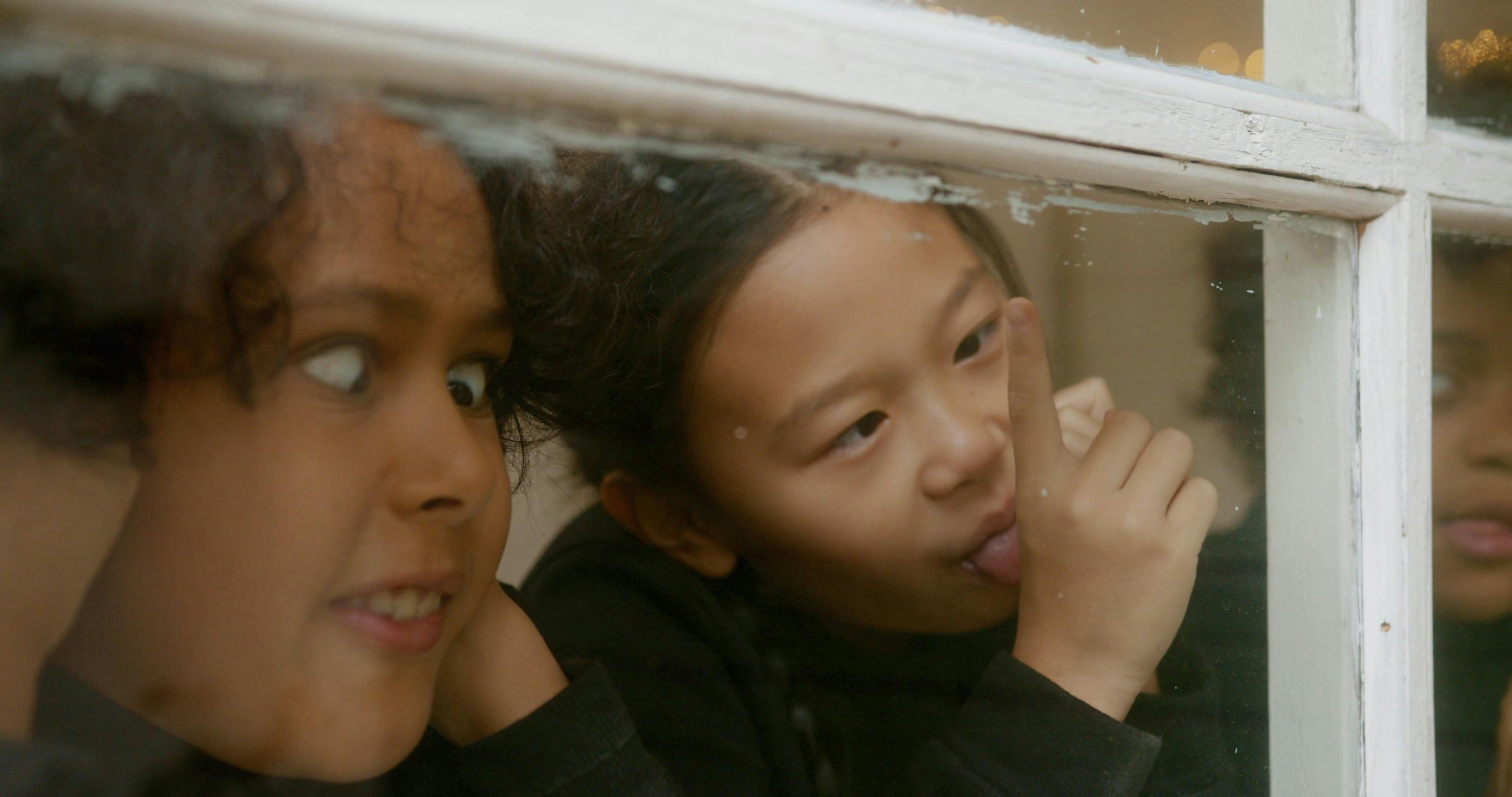 Children Doing Wacky Pose In Front of the Window Free Stock Video ...