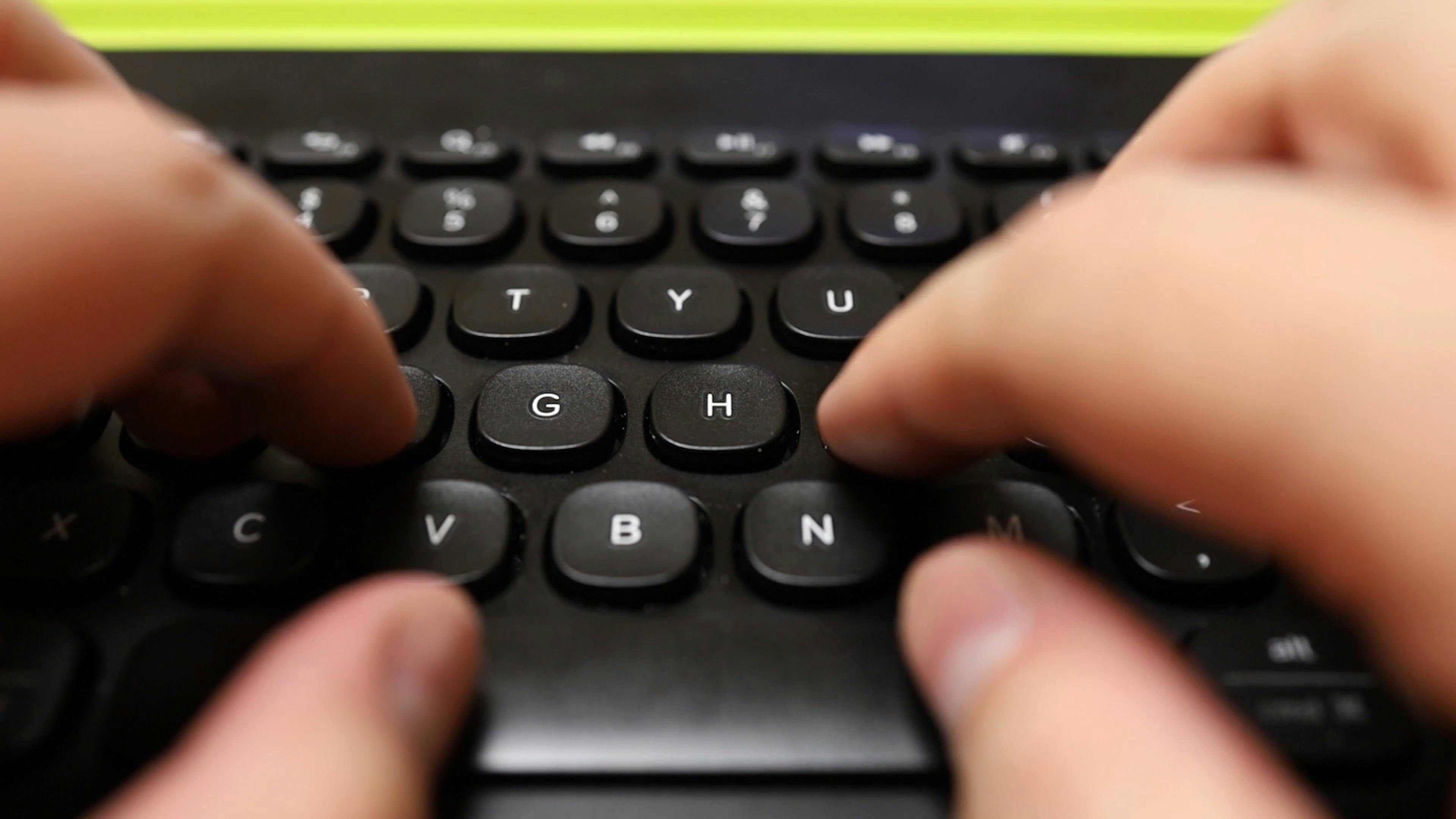 Close Up Video of a Person Typing on a Keyboard · Free Stock Video