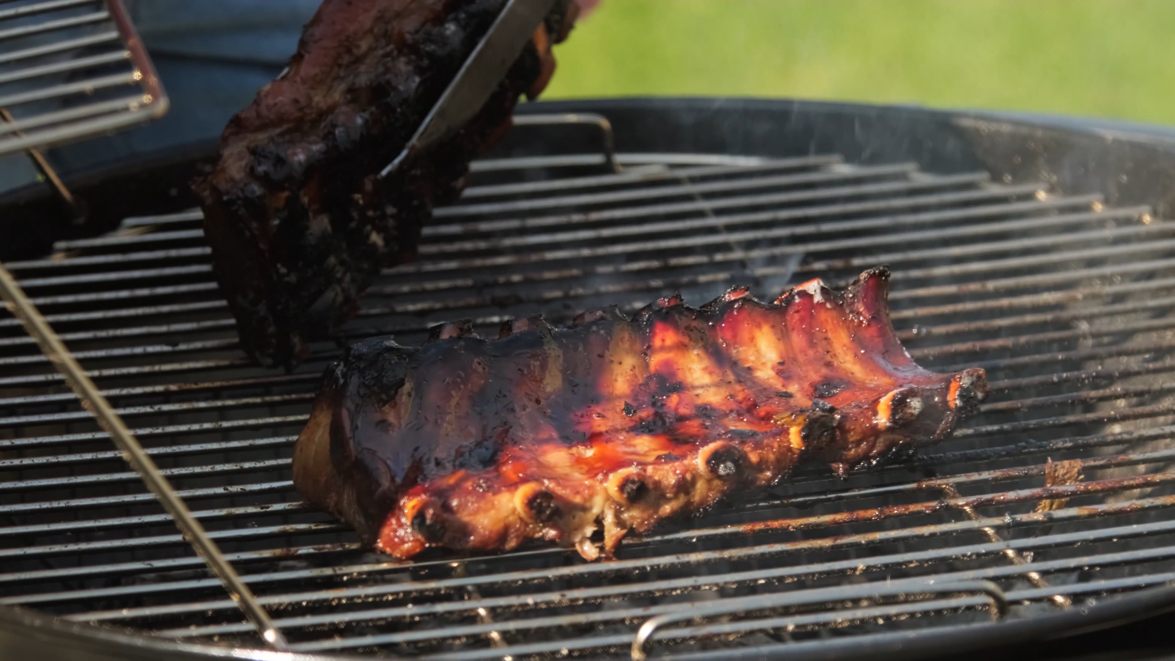 Person Cooking Food on a Grill · Free Stock Video