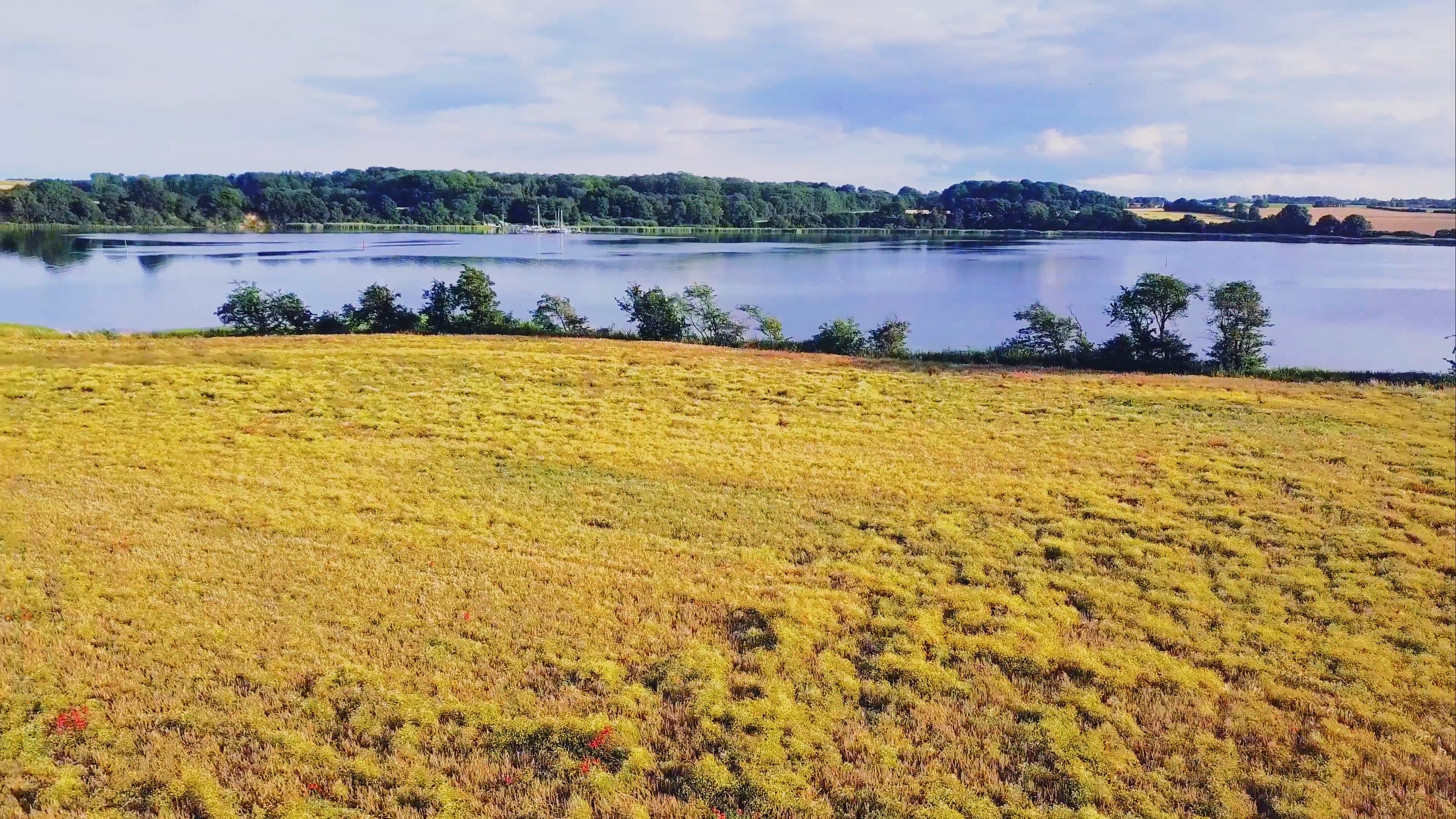 Drone View Of A Lake With Reflection Of The Blue Sky Free Stock Video ...