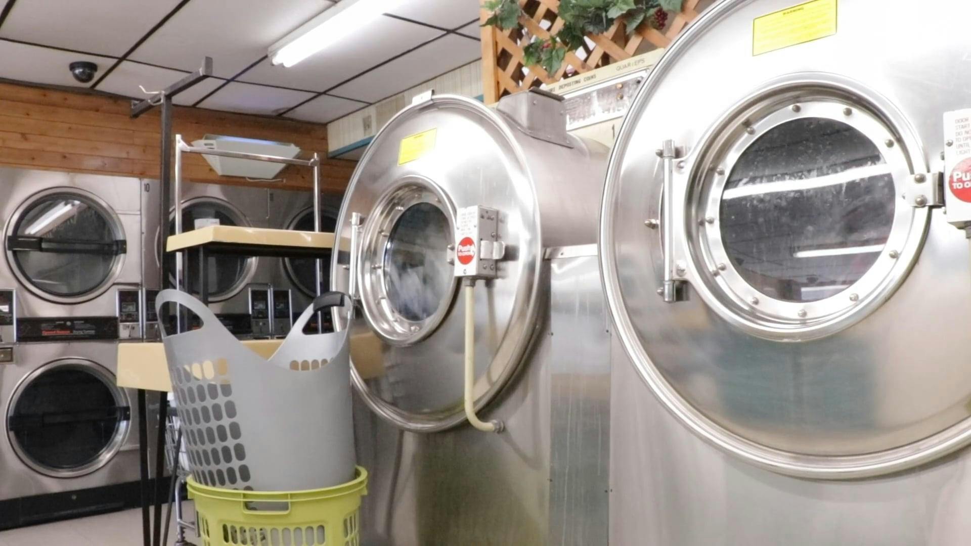 Washing Machines In Operation Inside A Laundry Facility · Free Stock Video