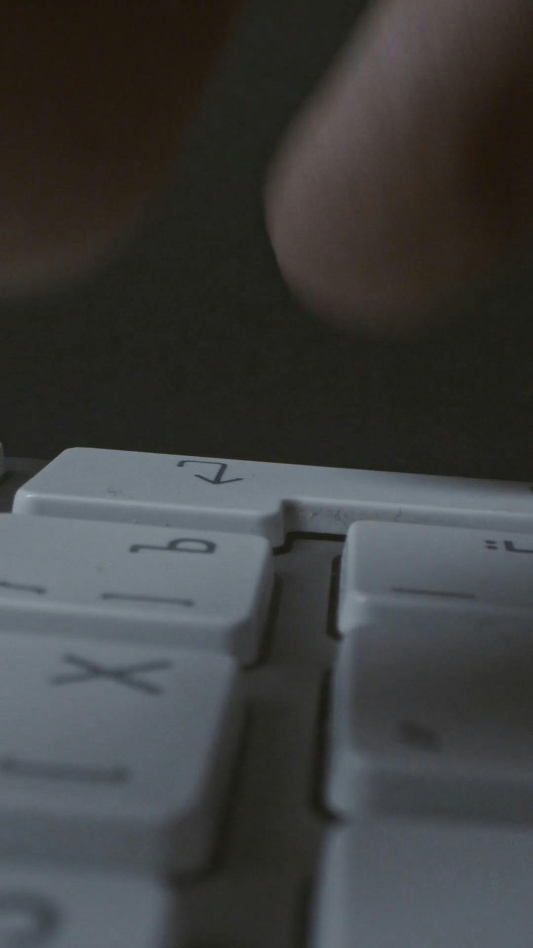 Close-Up View of a Person's Fingers Using an Apple Keyboard for Typing ...