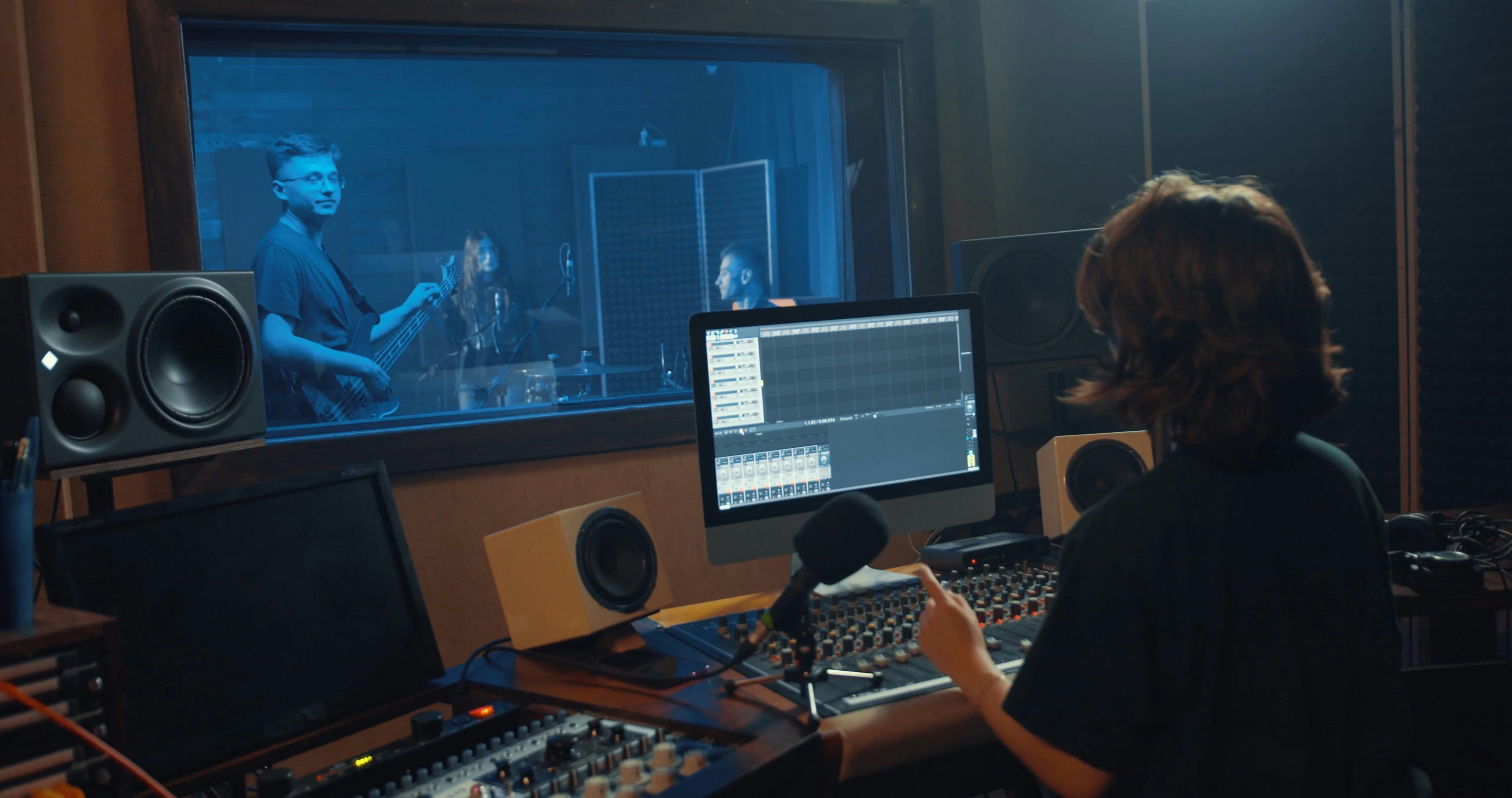 A Female Audio Engineer Recording A Band Music · Free Stock Video