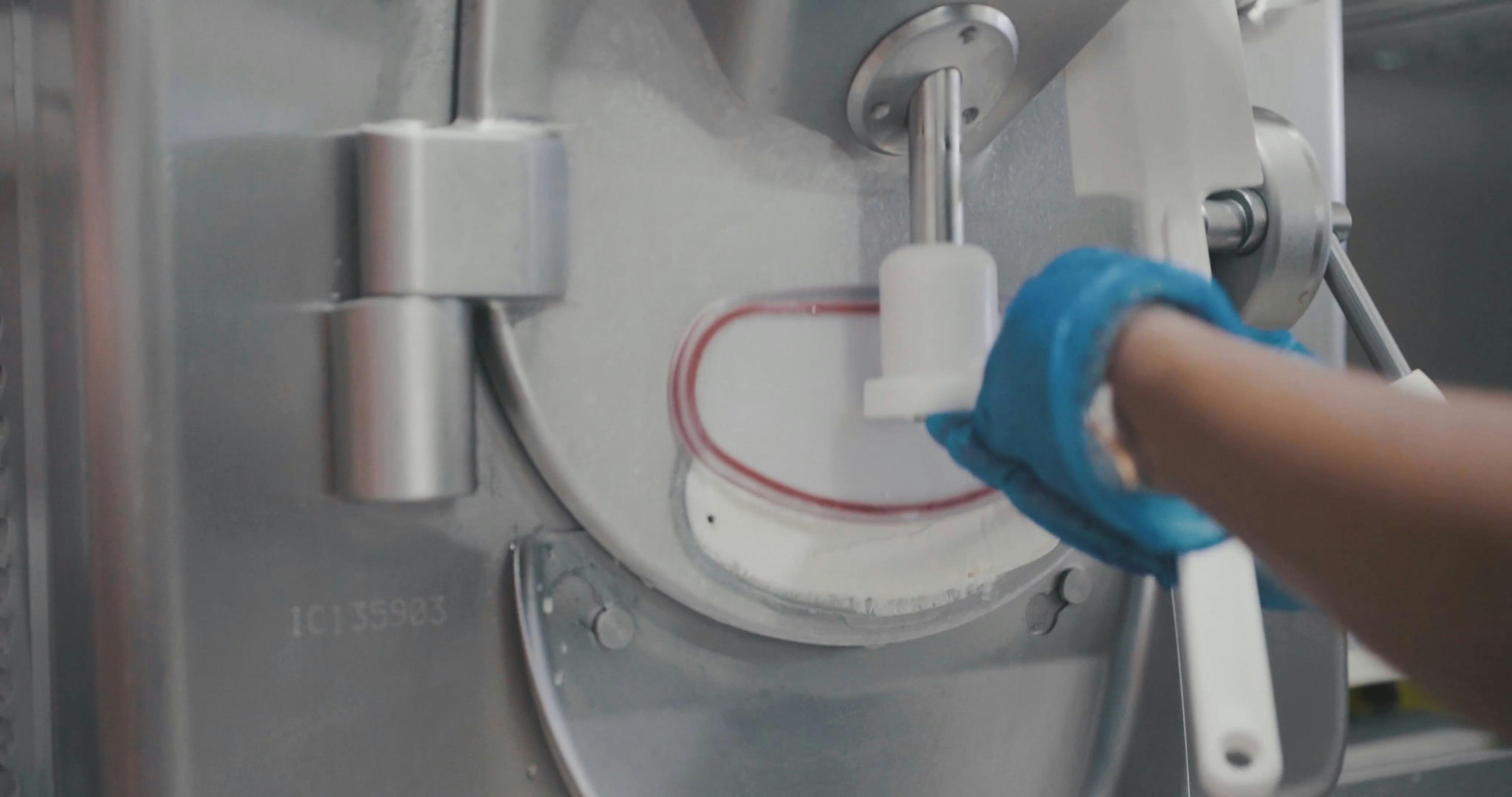 A Person Getting Ice Cream from a Machine Free Stock Video Footage ...