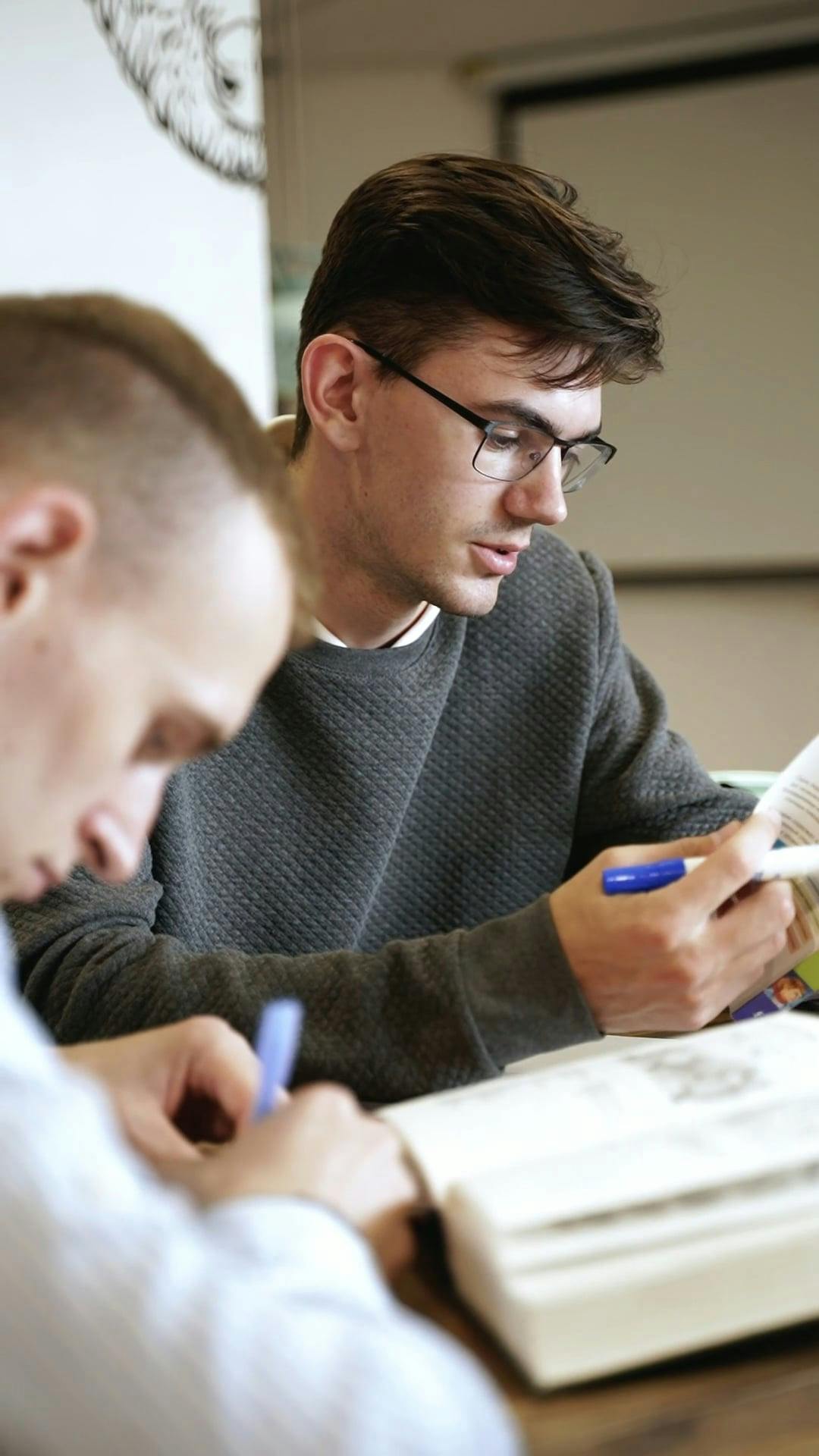 Man Taking Notes From A Book · Free Stock Video