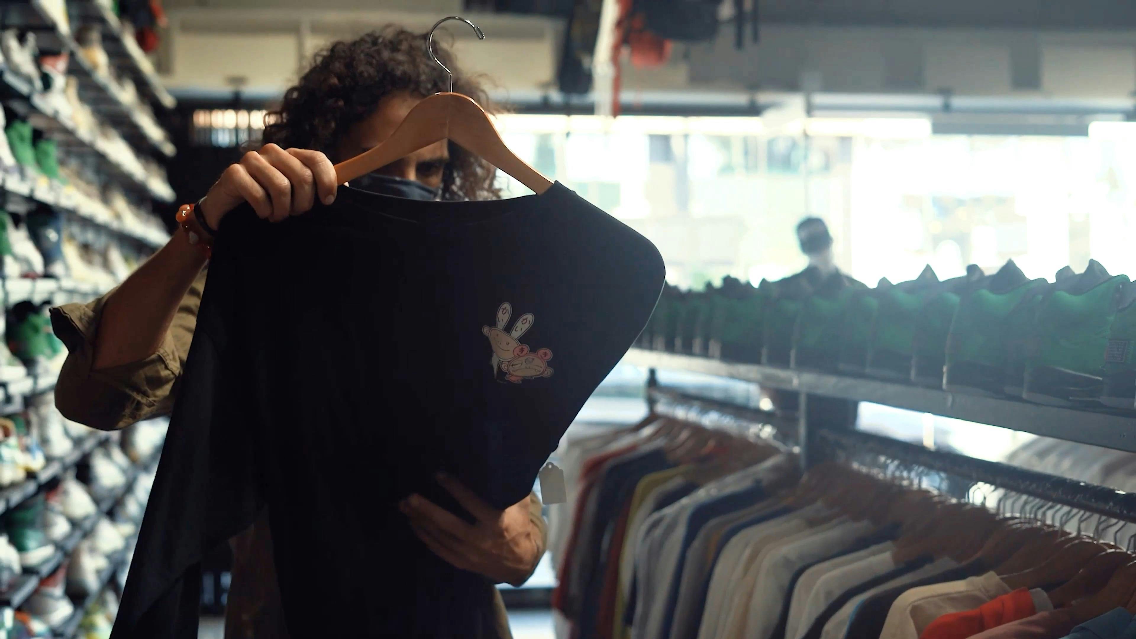 A Man Putting Back the Shirt on the Rack Free Stock Video Footage ...