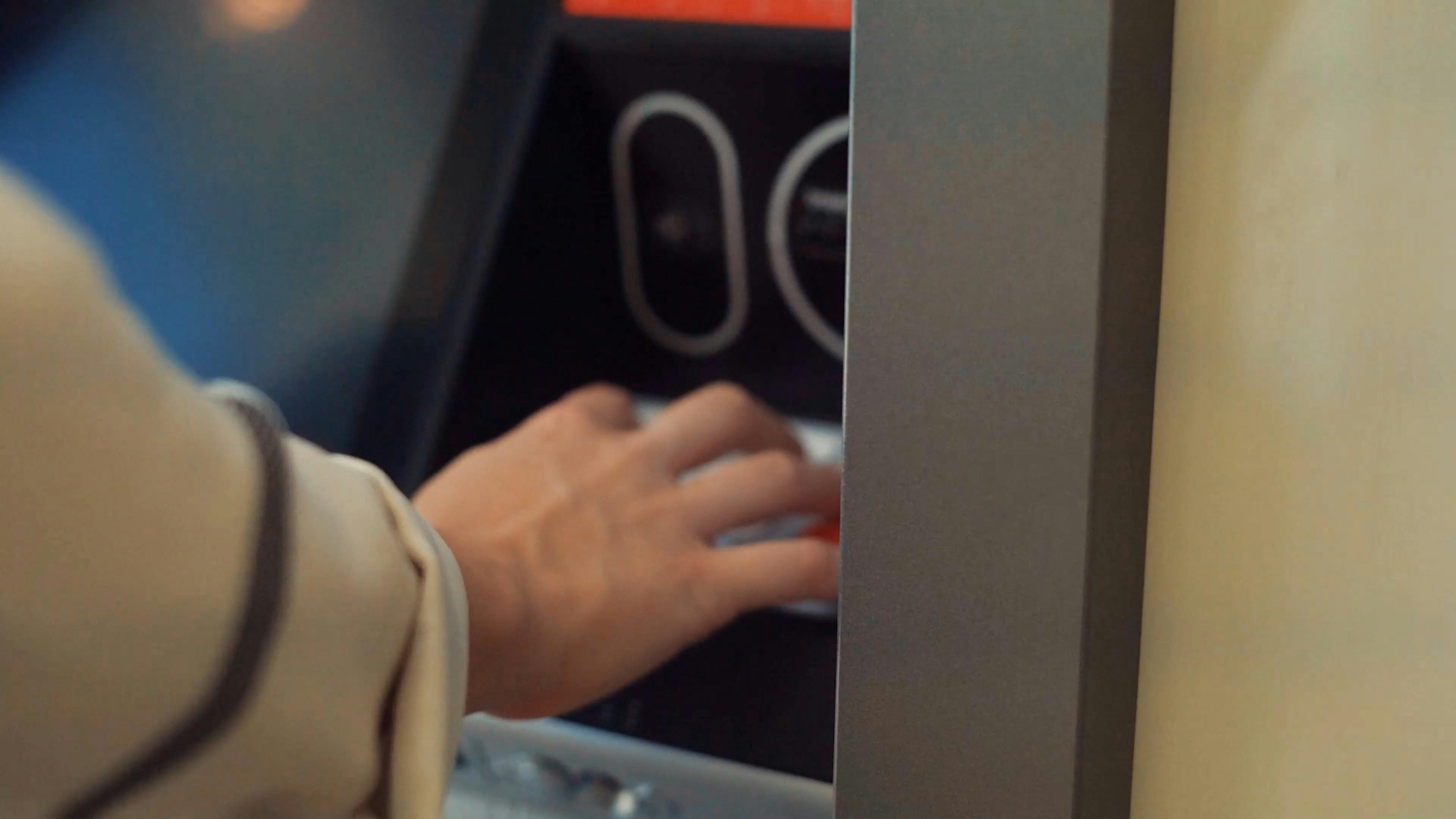 Person Wearing Gloves Pressing Buttons of a Machine · Free Stock Video