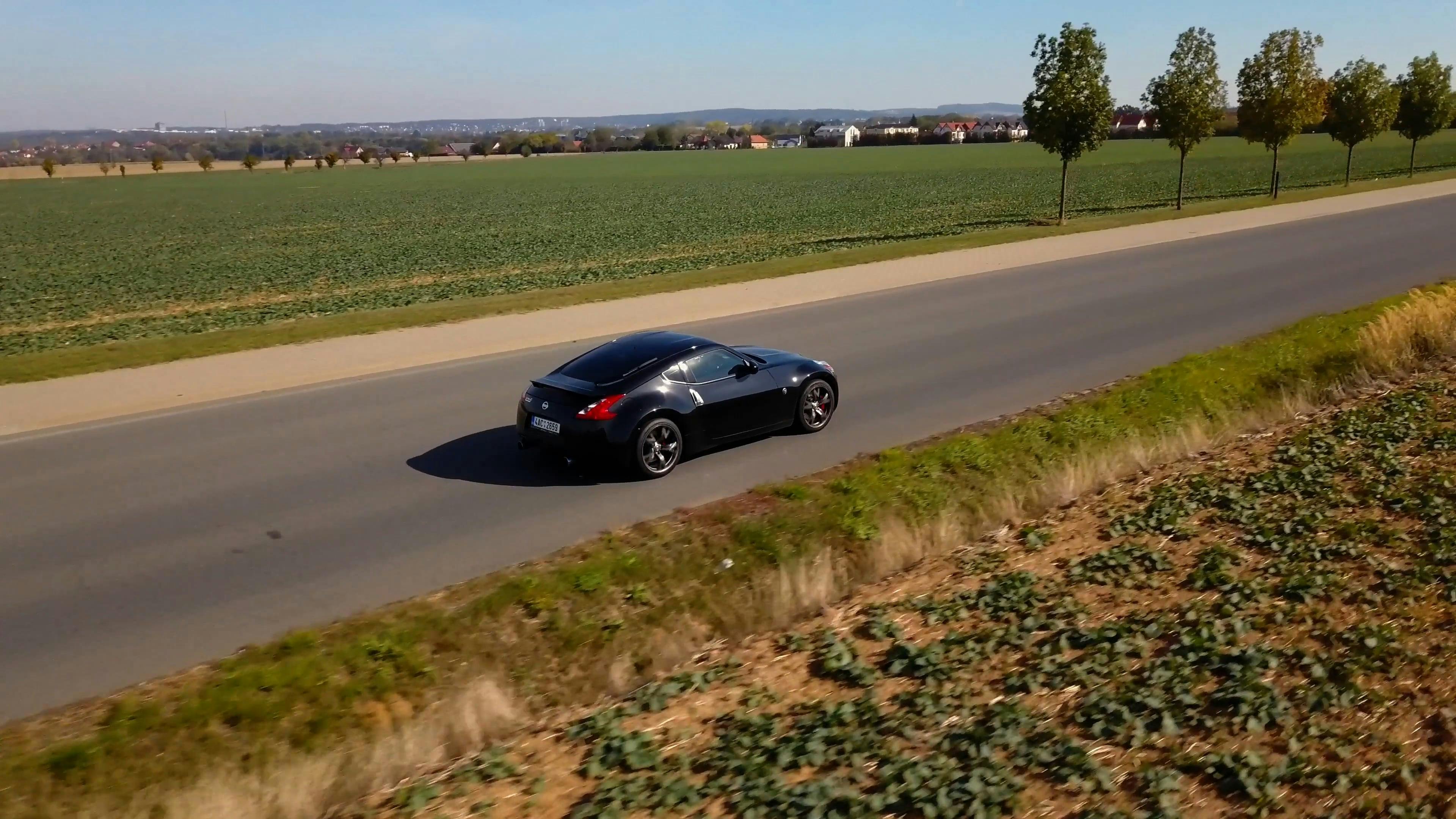 An Aerial Footage of a Sports Car on the Road Free Stock Video Footage ...