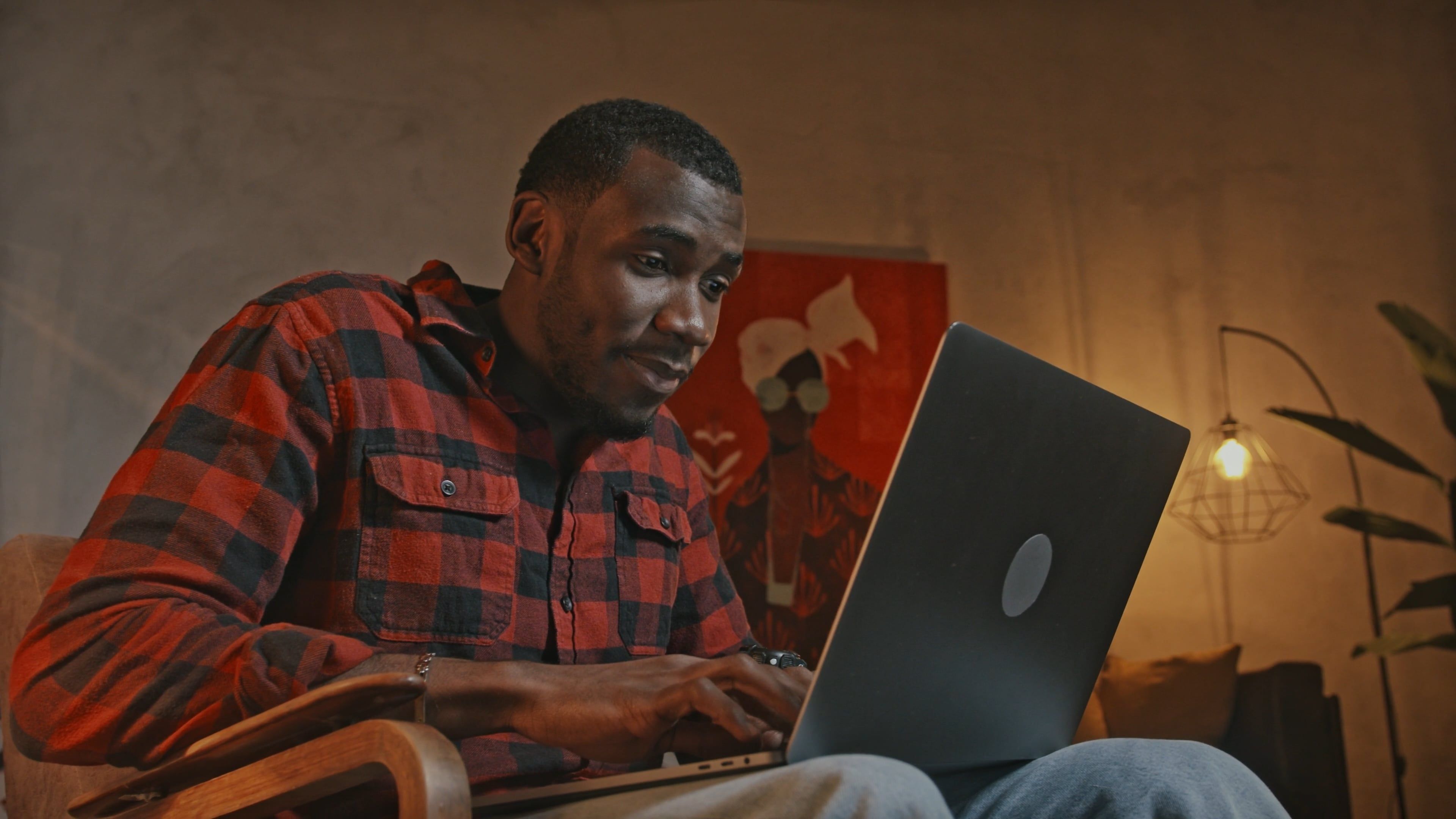 Excited Young Man Typing on Laptop · Free Stock Video