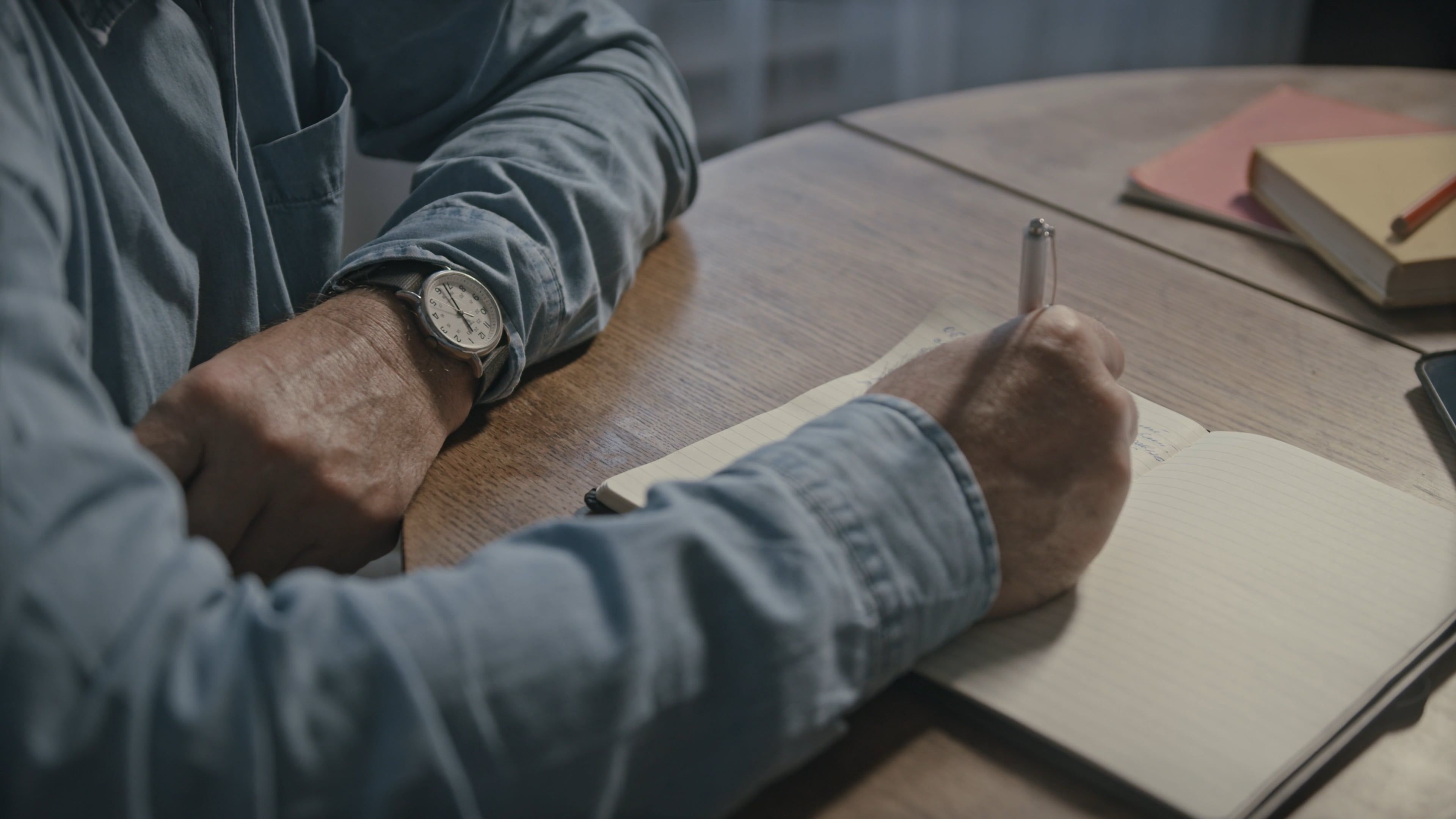 Man Writing on a Notebook · Free Stock Video
