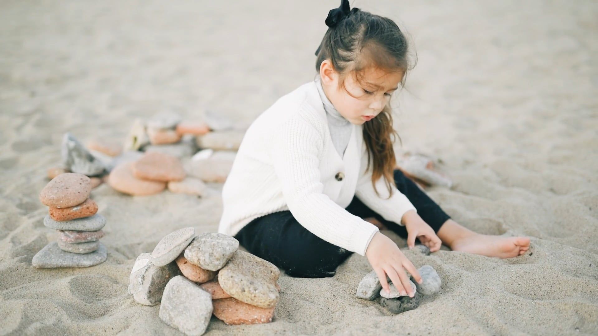 Little Girl Playing with Rocks in the Sand Free Stock Video Footage ...