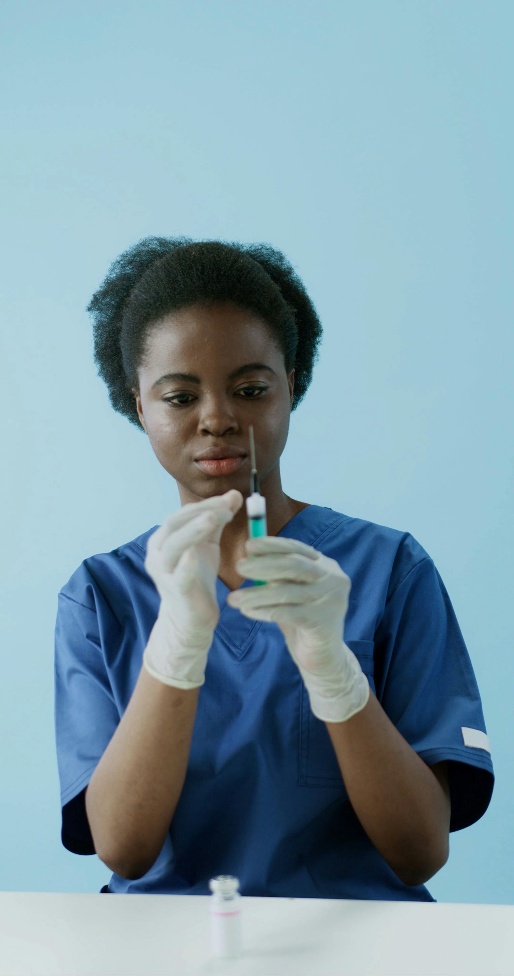 Person Getting a Syringe Ready for Vaccination · Free Stock Video