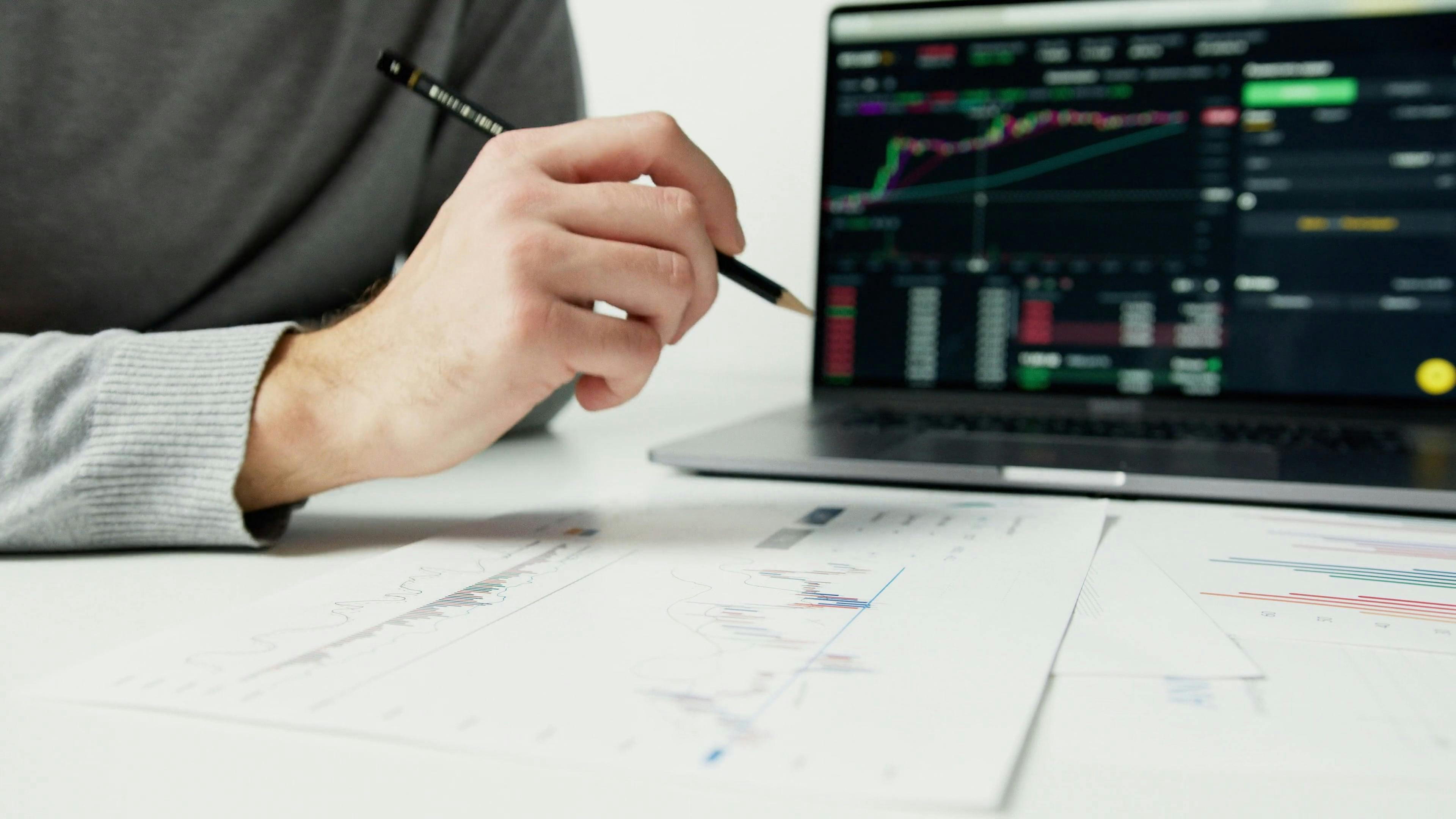 A Person Reading Stock Charts · Free Stock Video