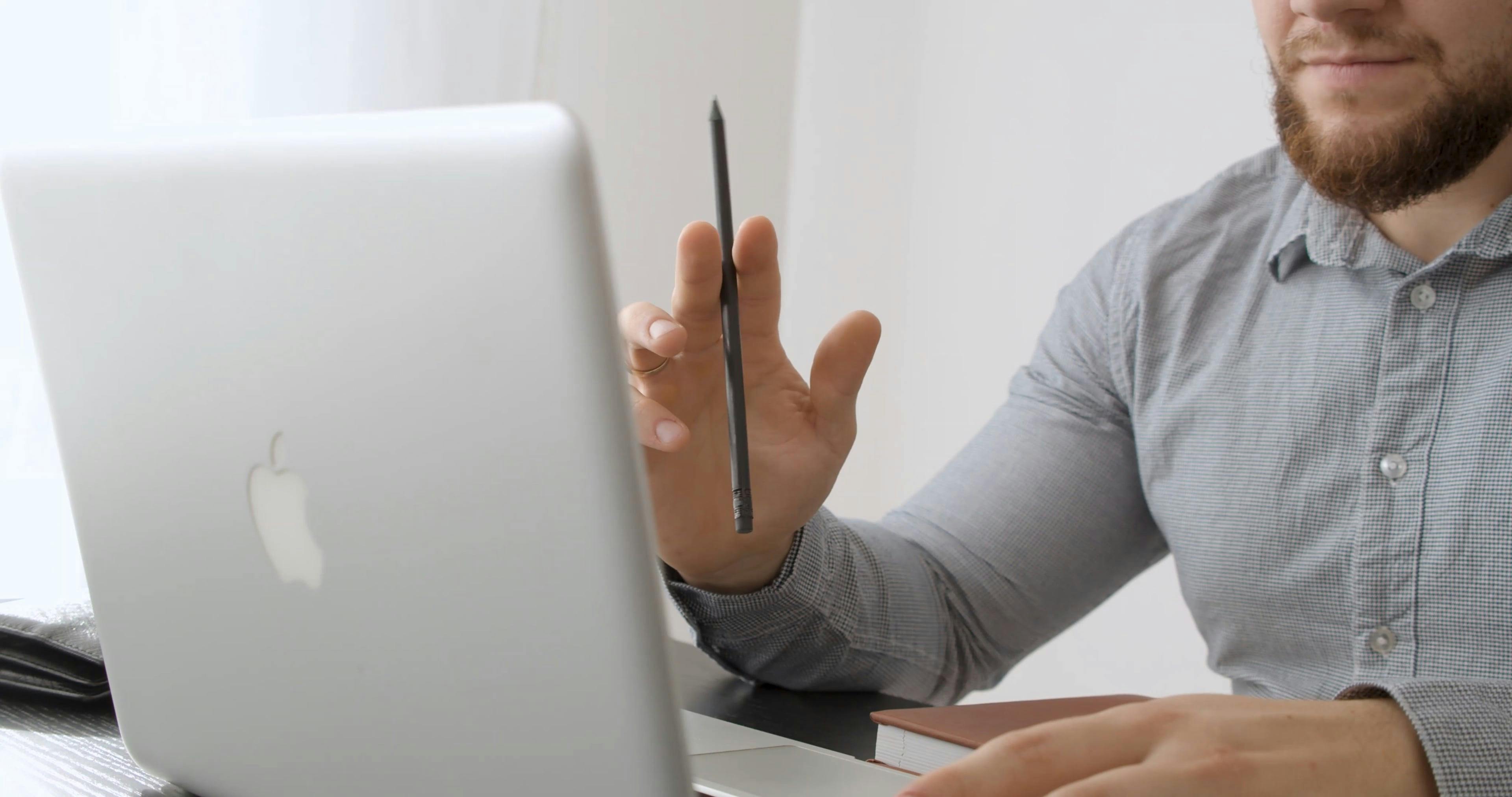 Faceless Man Working on a Laptop · Free Stock Video