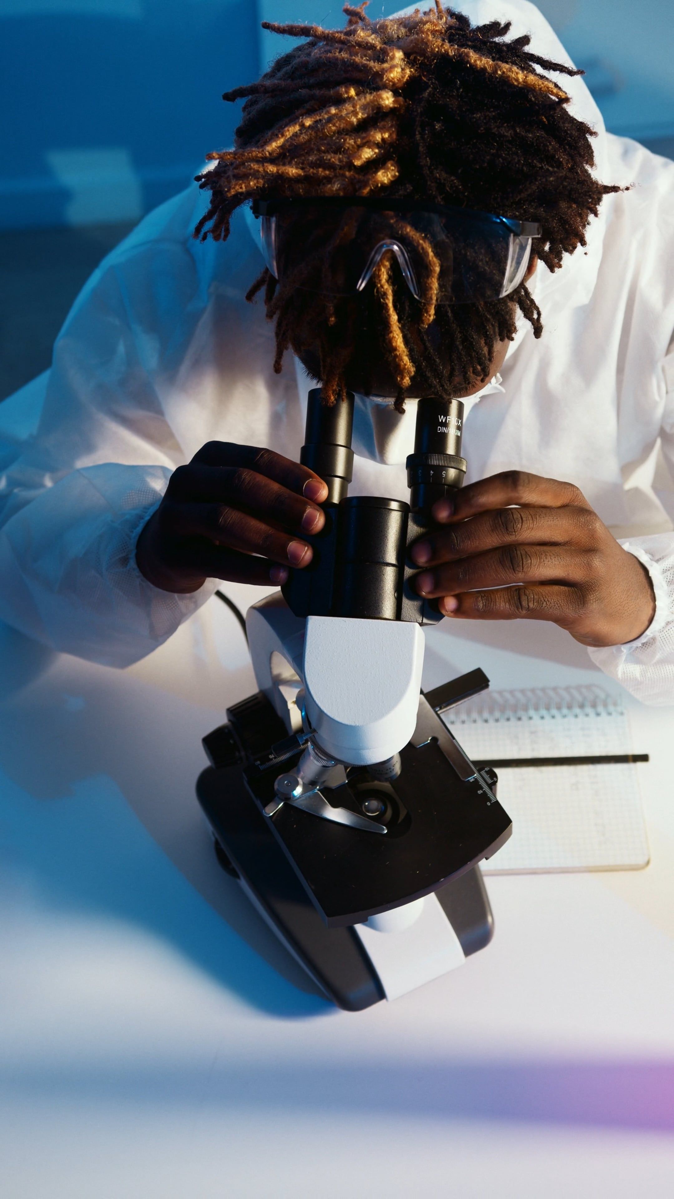 A Man Using a Microscope · Free Stock Video