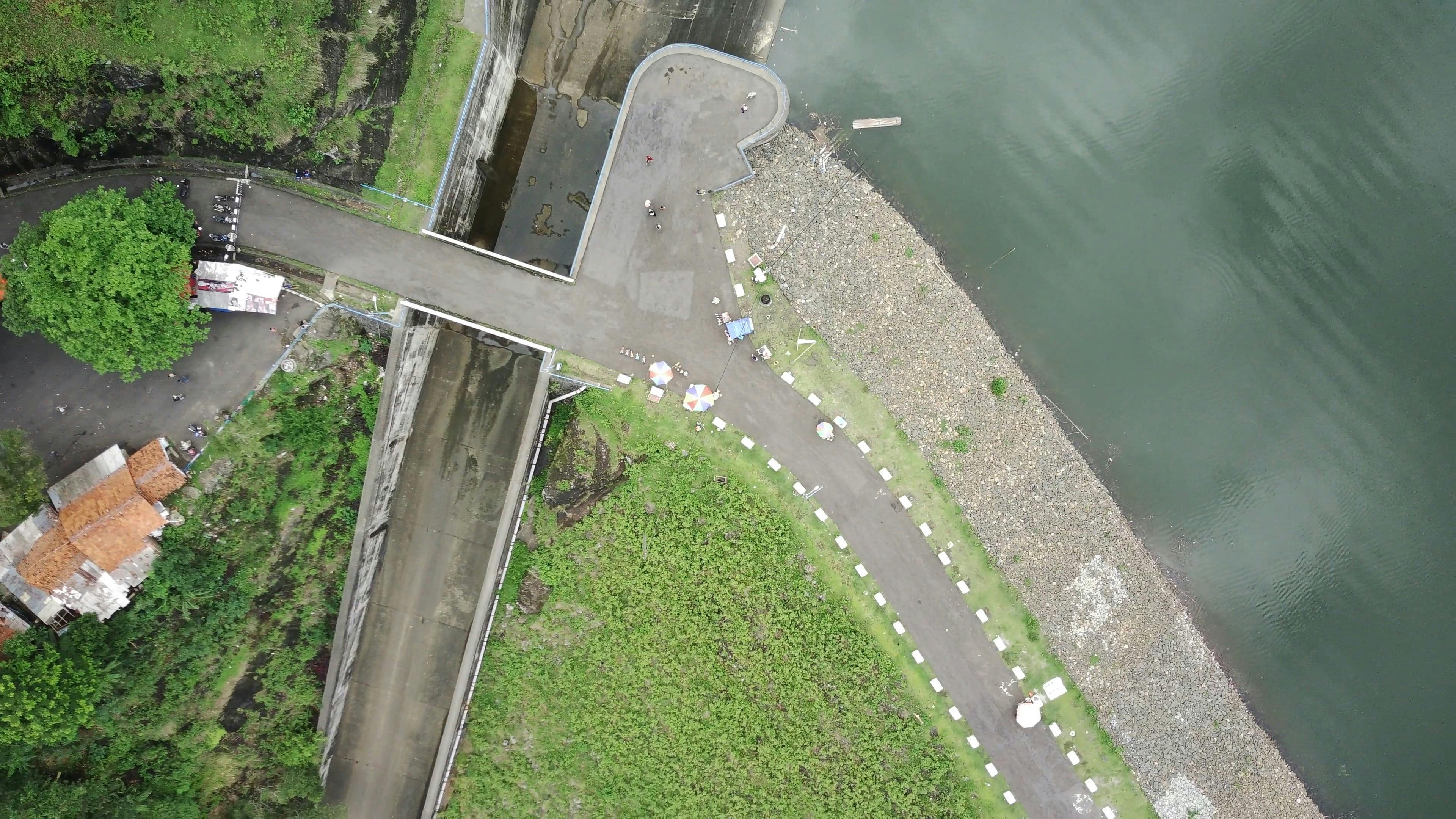 Drone Flying Over The Surface Of A Lake Dam · Free Stock Video