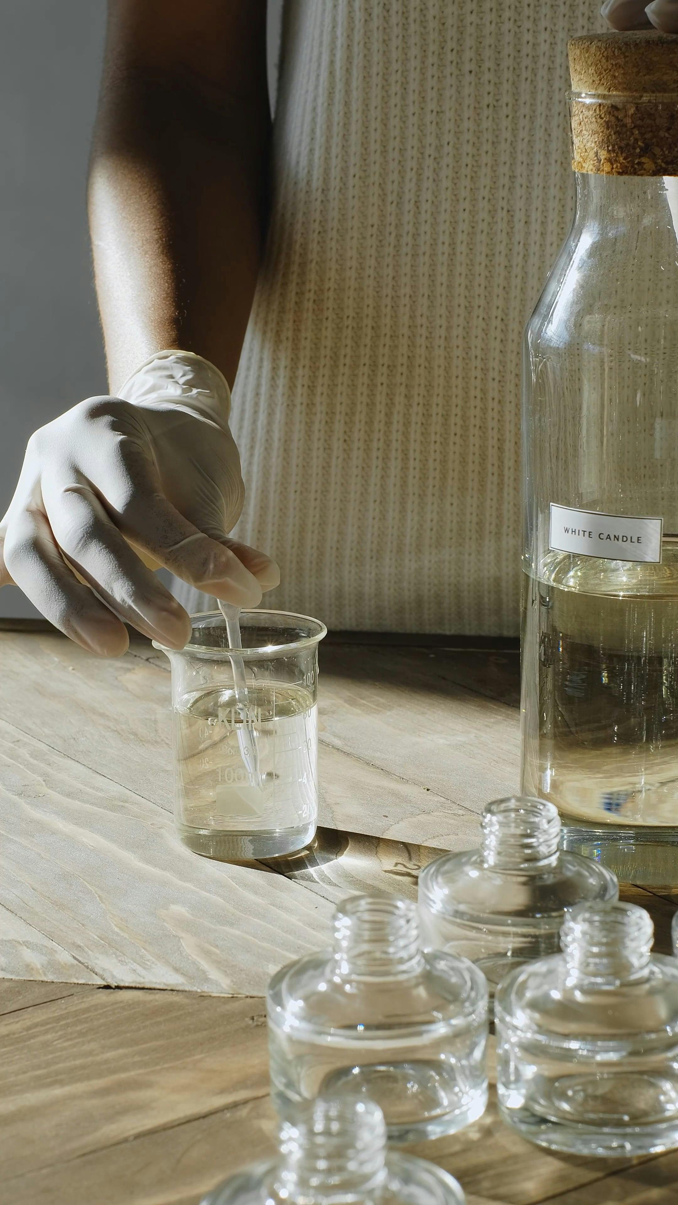 A Dropper Pouring Liquid in to the Black Bottle · Free Stock Video