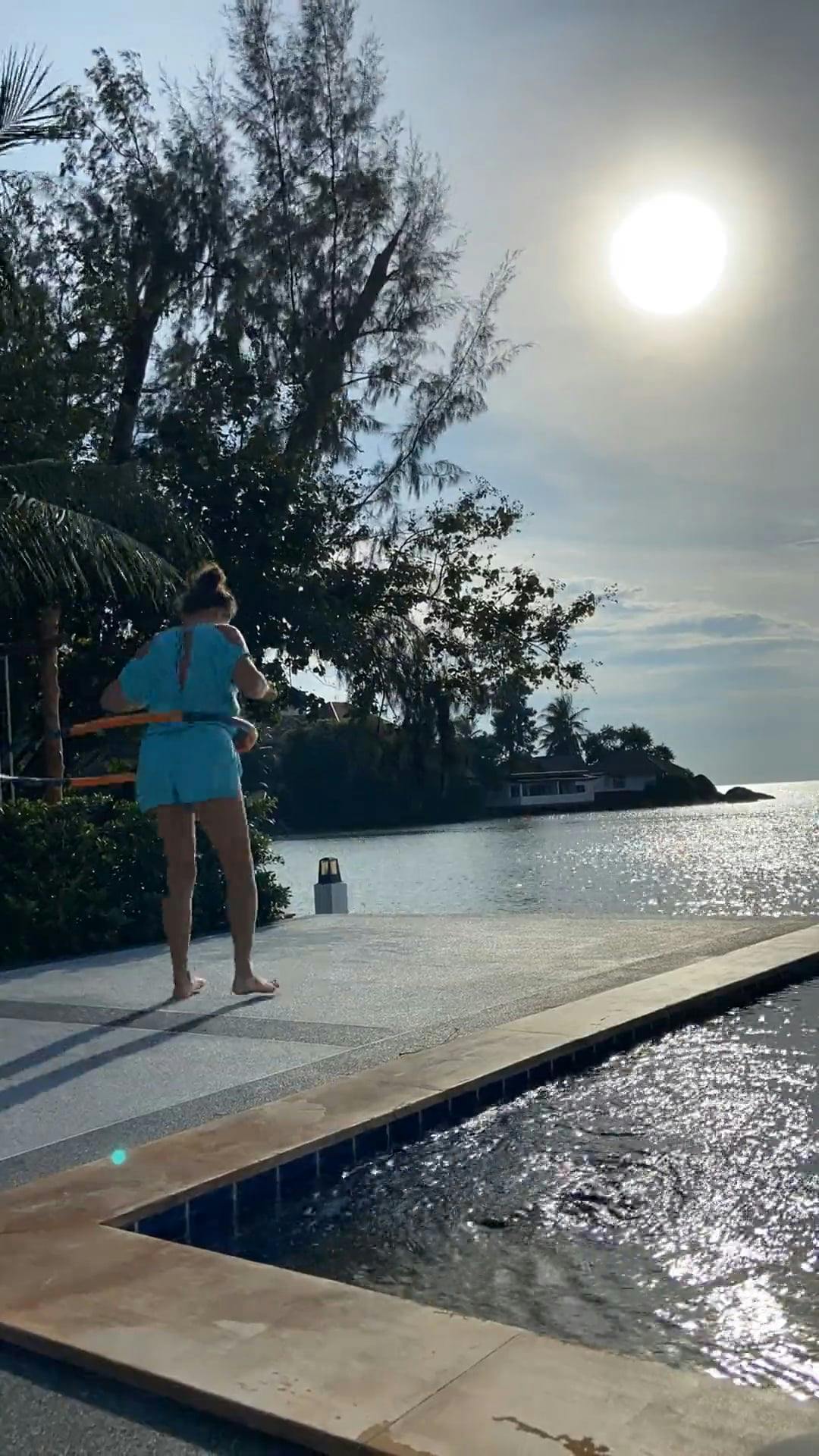 Young Woman Hula Hooping next to Infinity Pool Time Lapse Free Stock ...