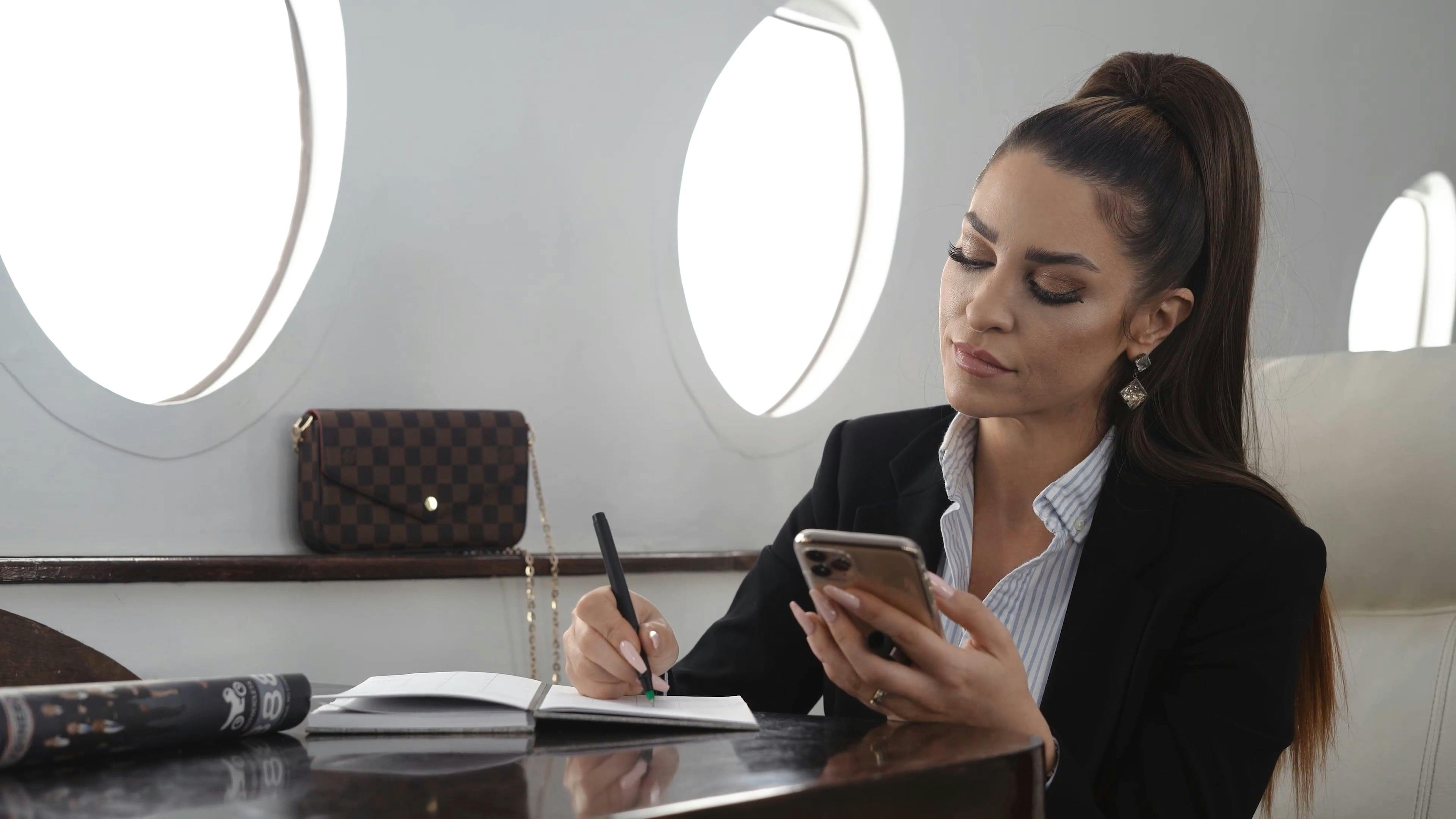 Woman Using her Phone While Writing Free Stock Video Footage, Royalty ...