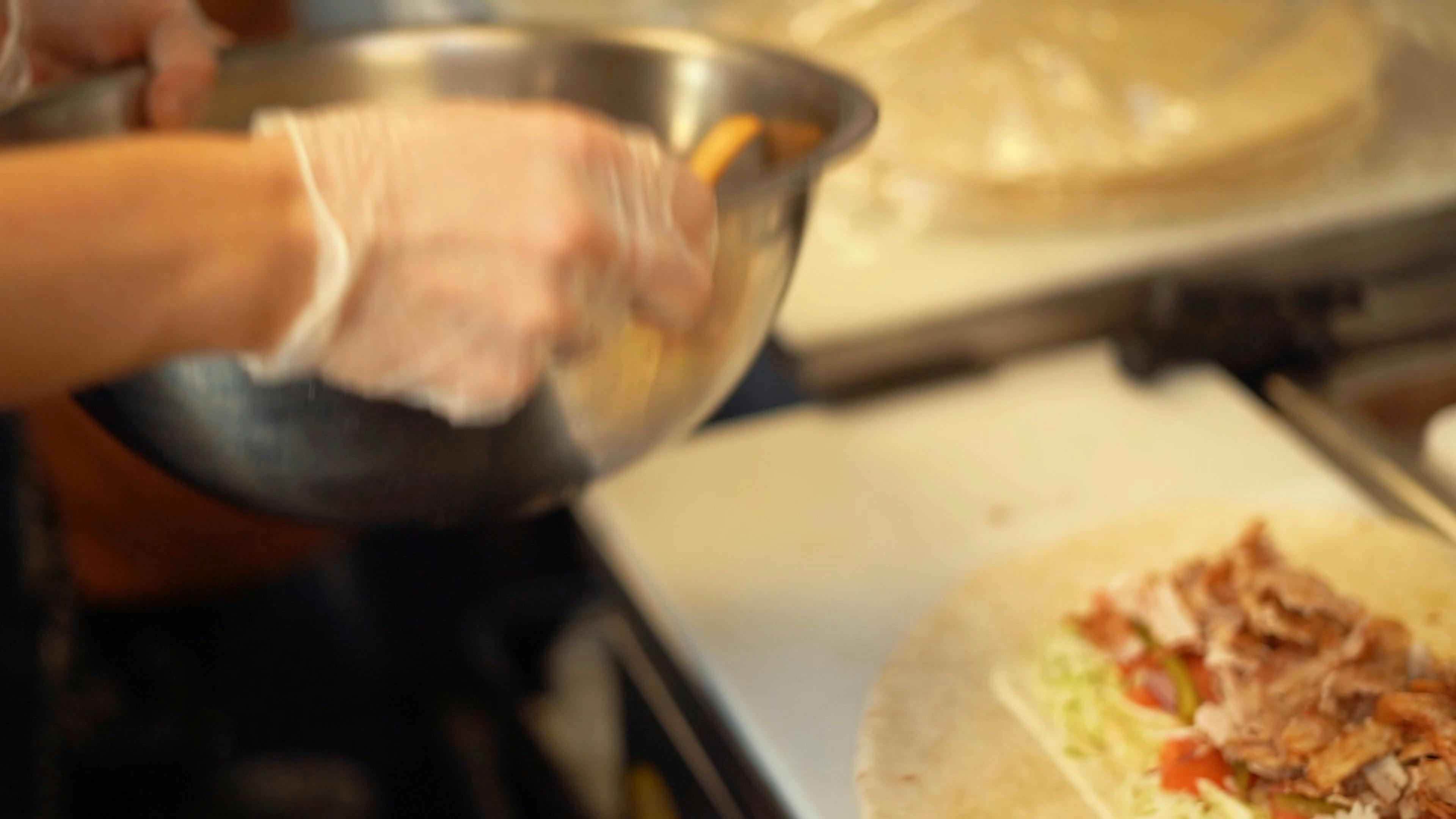 Person Tossing Fries on the Stainless Mixing Bowl Free Stock Video ...