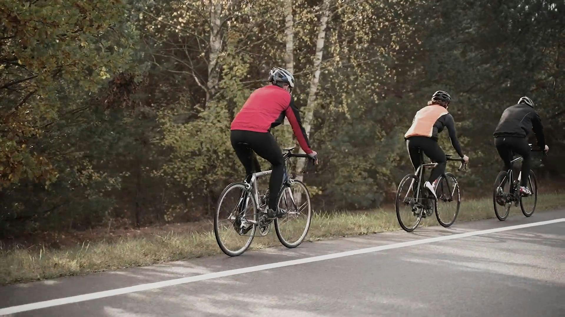 Three Cyclists on Road · Free Stock Video